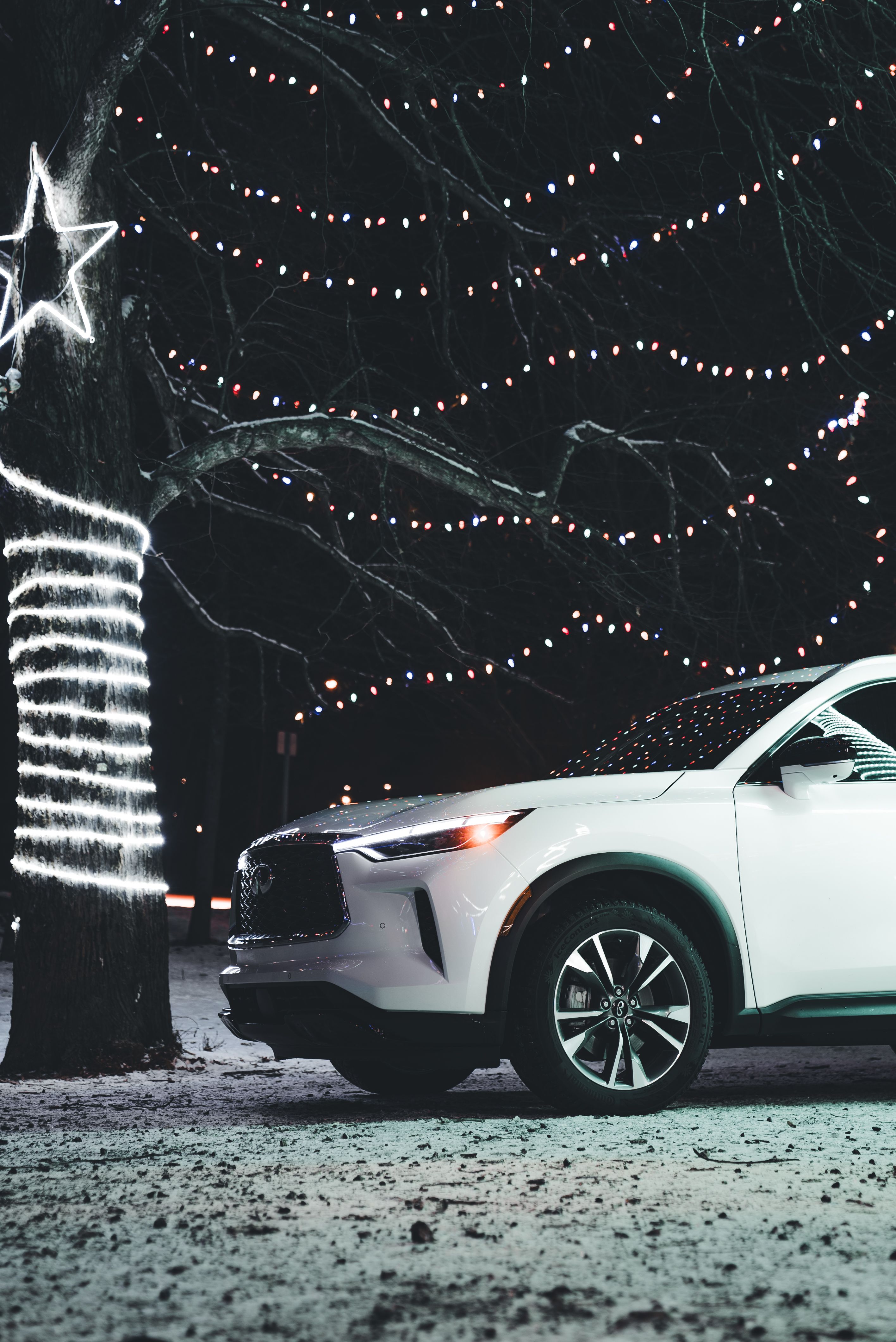 Christmas Lights over Infiniti QX60 at Night · Free Stock Photo