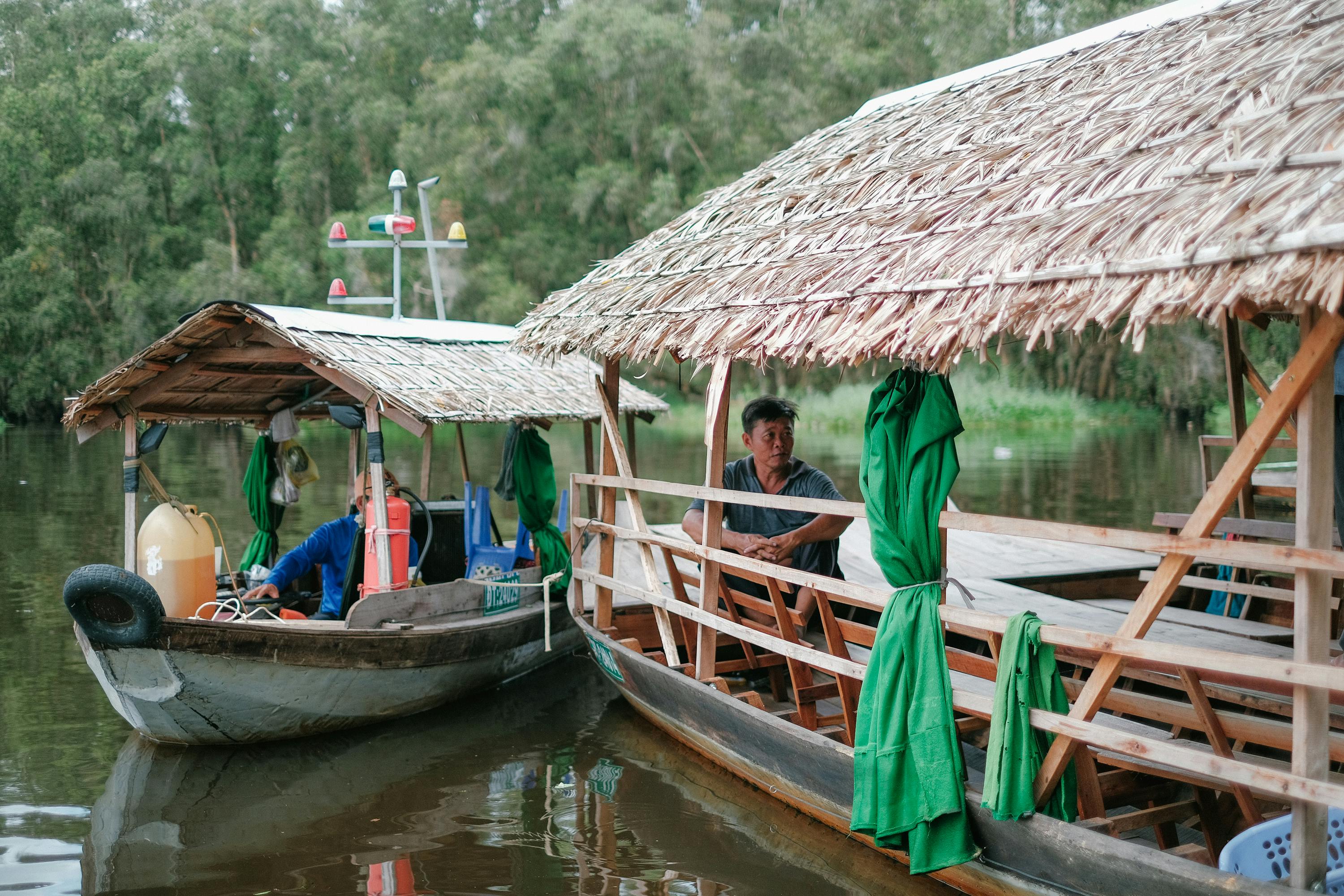 Traditional Vietnamese Boats Sailing on the River · Free Stock Photo