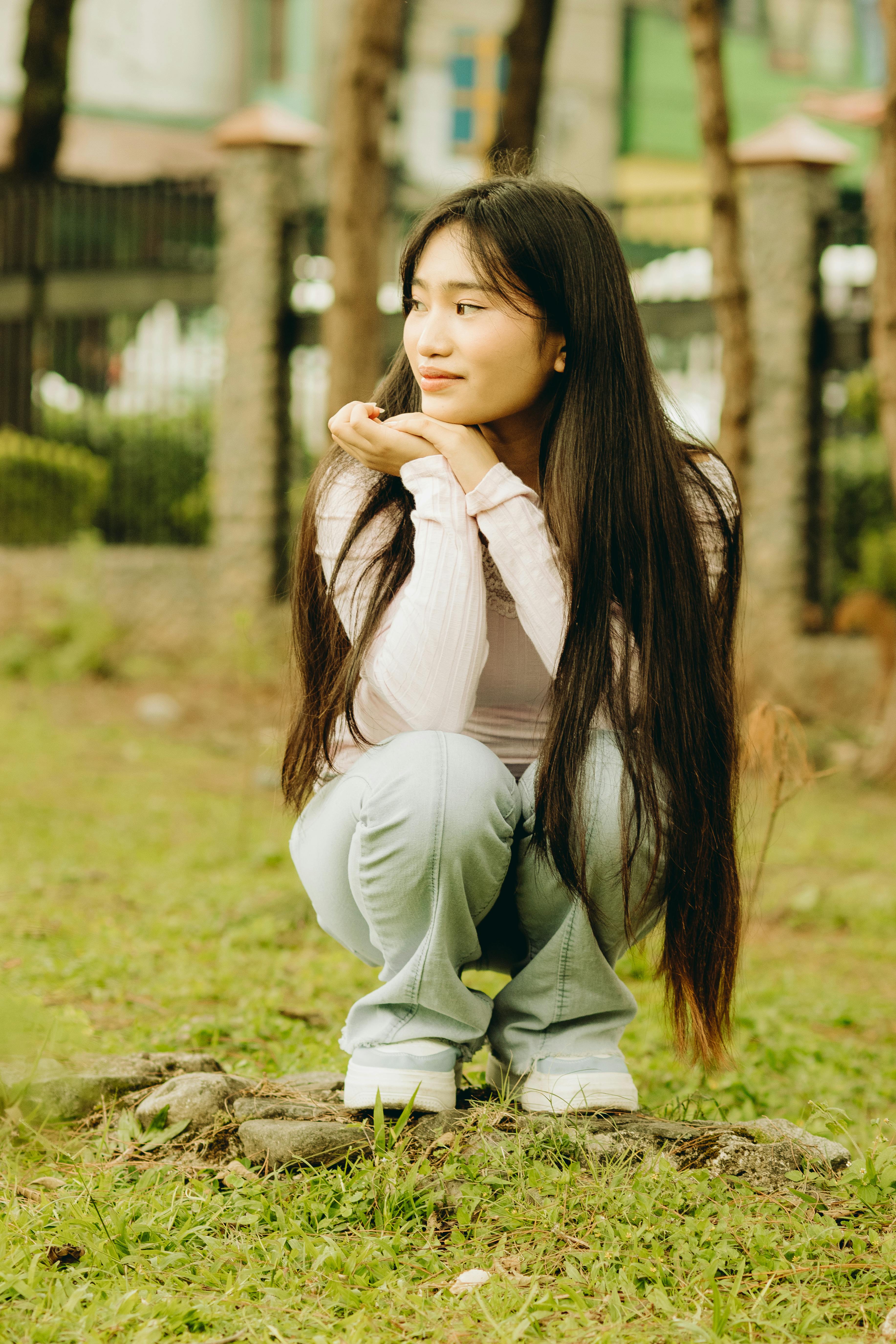 Portrait of a Woman Crouching · Free Stock Photo