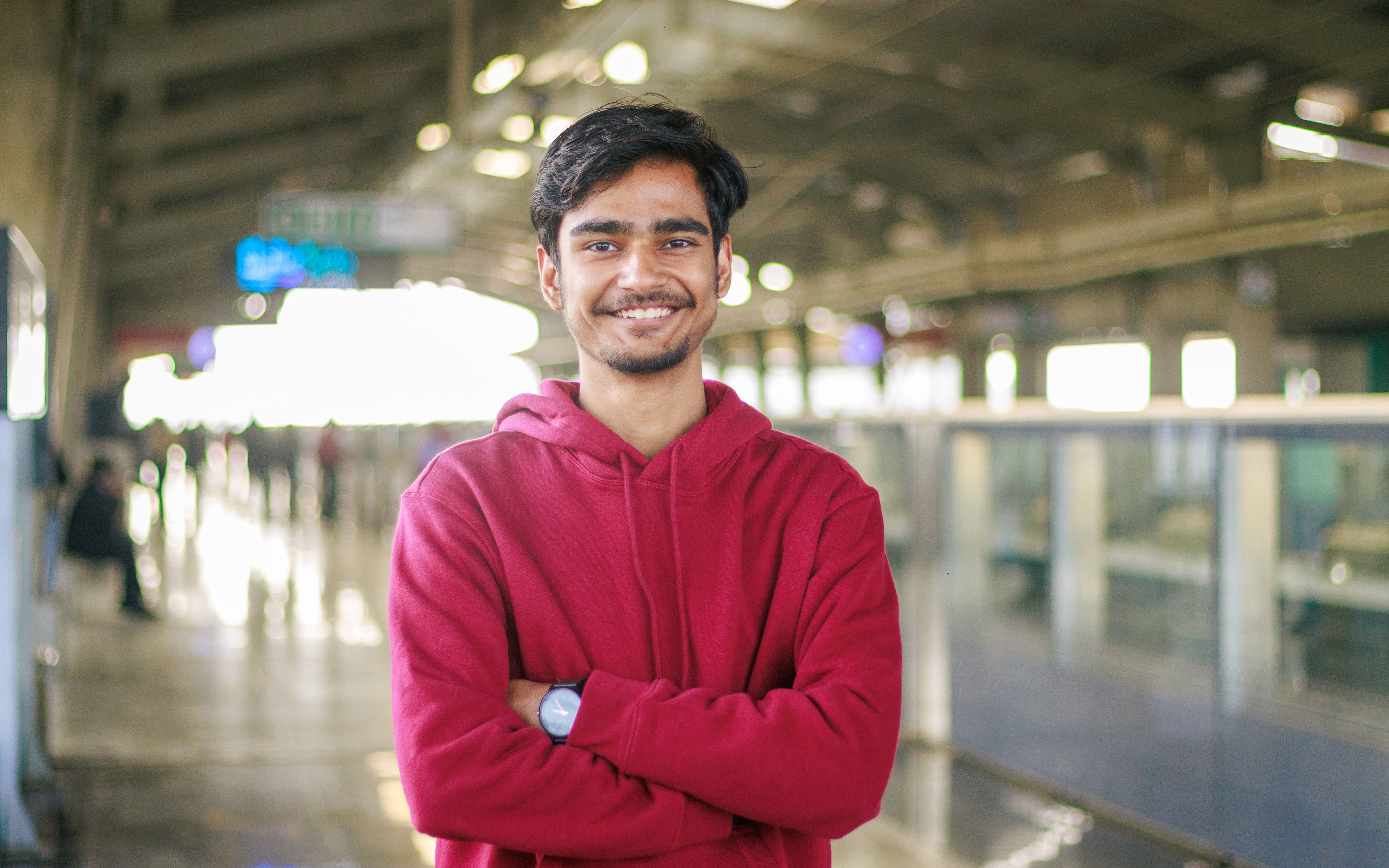 Portrait of young Indian man passenger traveling in the metro or subway ...