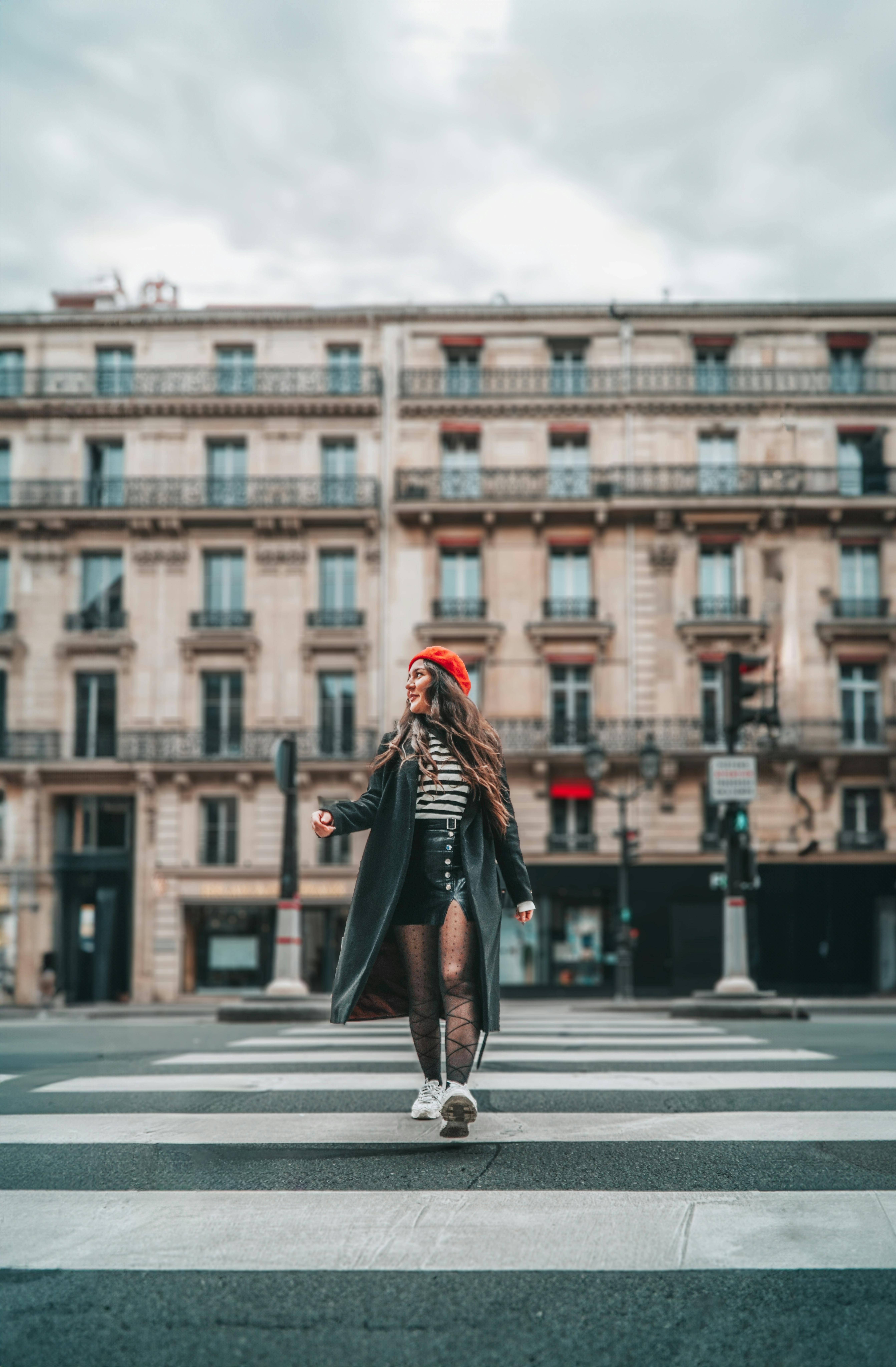 A Fashionable Woman Crossing the Street in City · Free Stock Photo