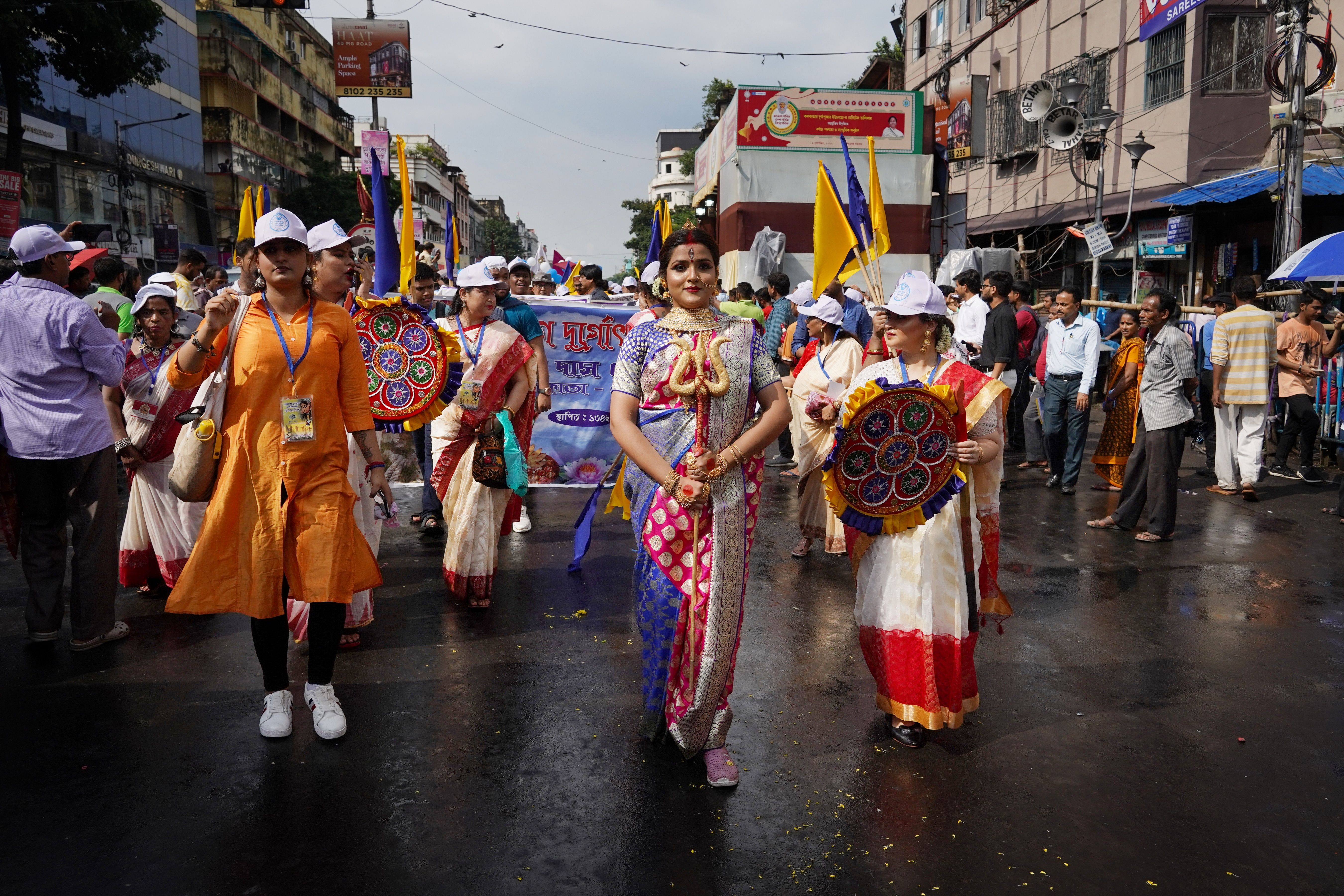 People in Folk Costumes Walking on a Street in City during a ...