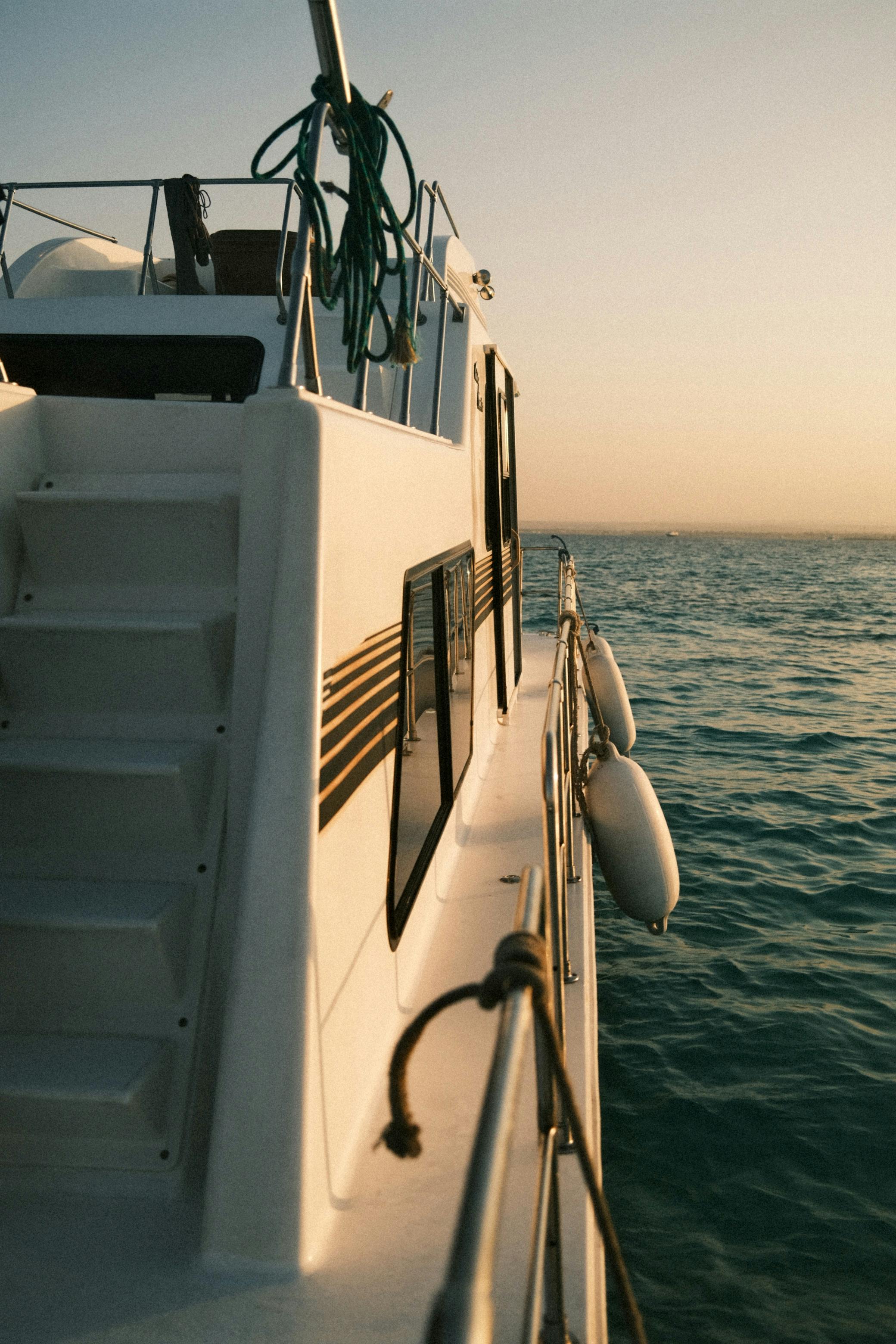 Ferry Swimming in a Sea During Sunset · Free Stock Photo