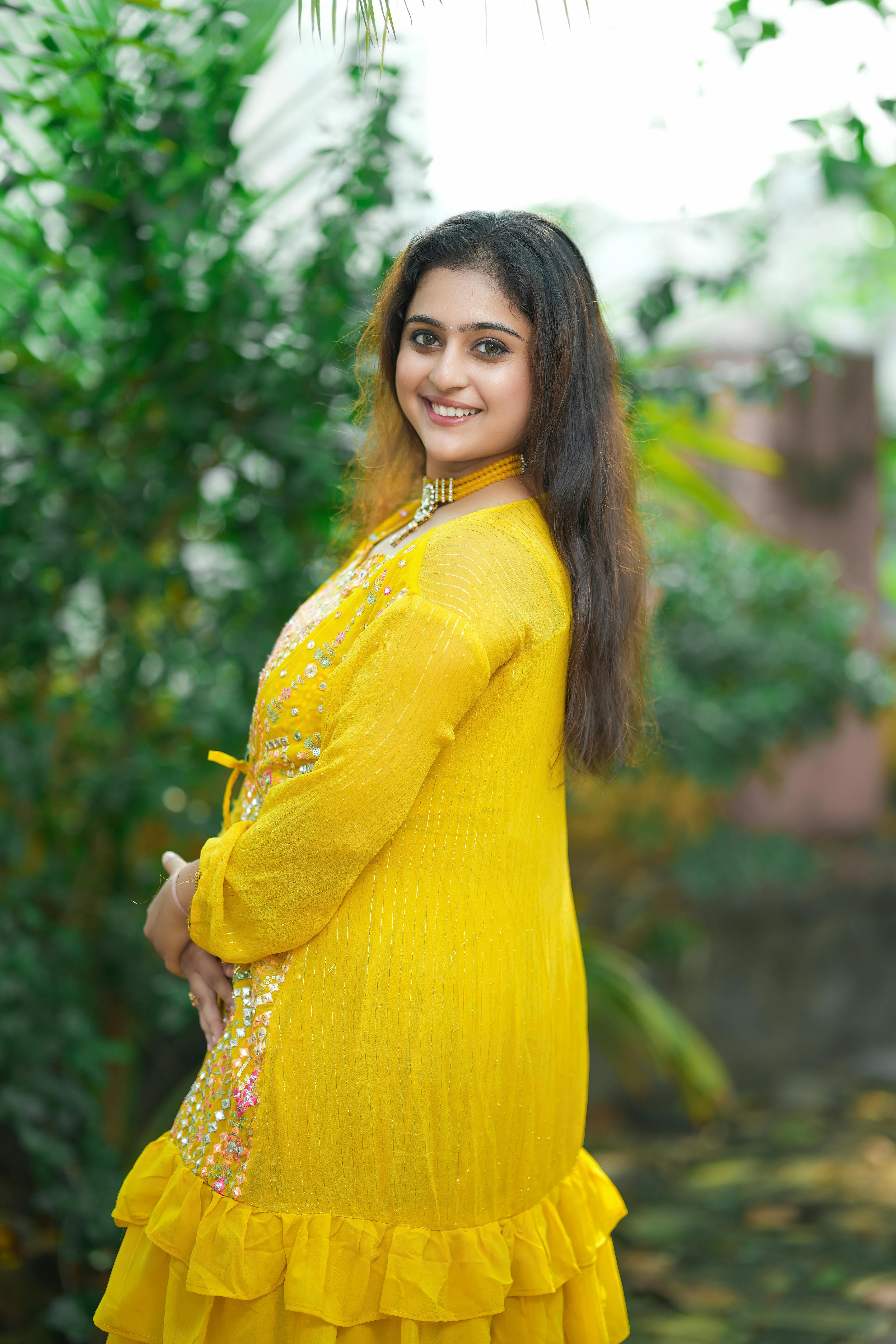 Portrait of Woman Wearing Yellow Dress Among Leaves · Free Stock Photo