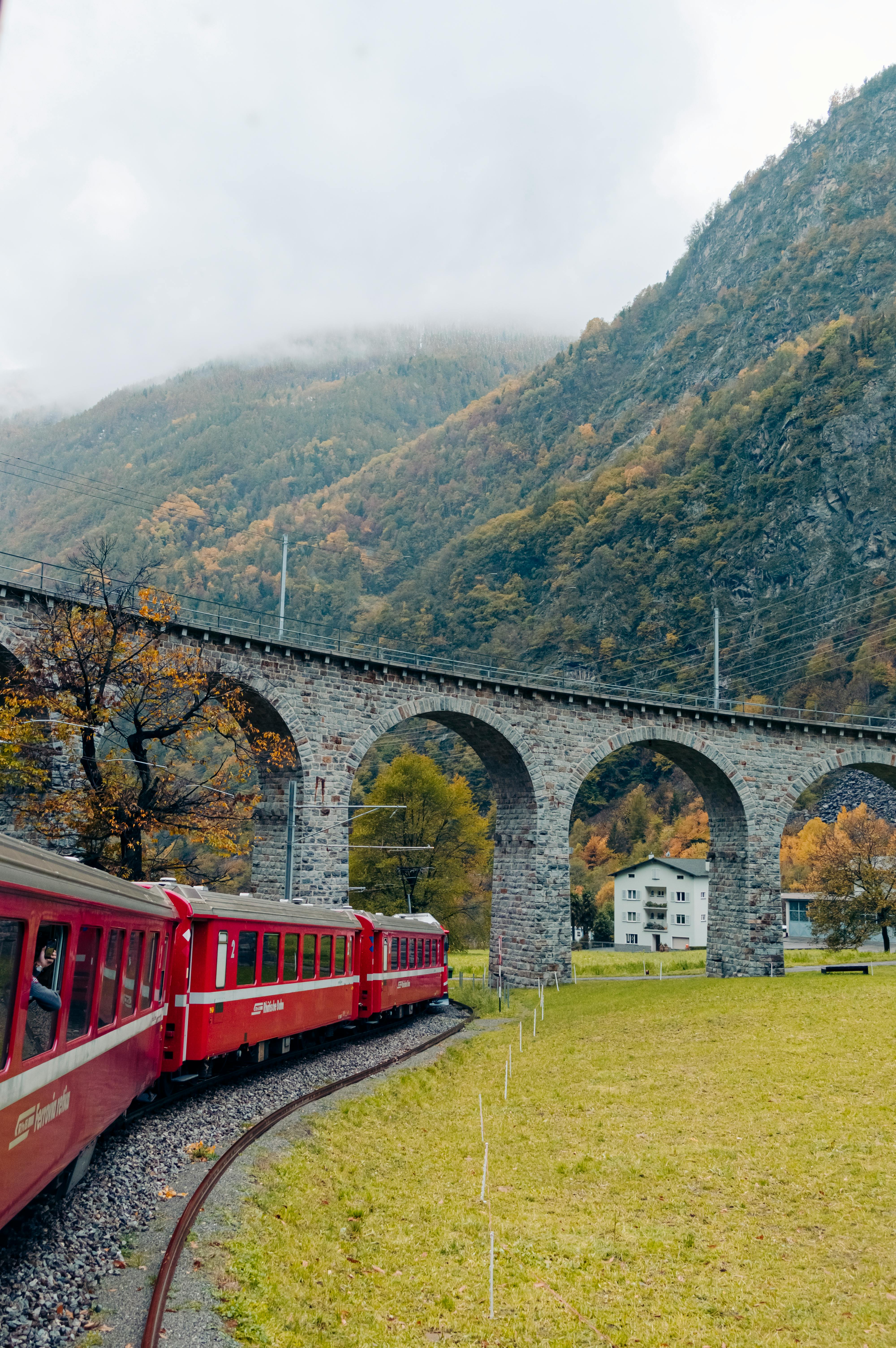 Red Train in a Mountain Valley · Free Stock Photo