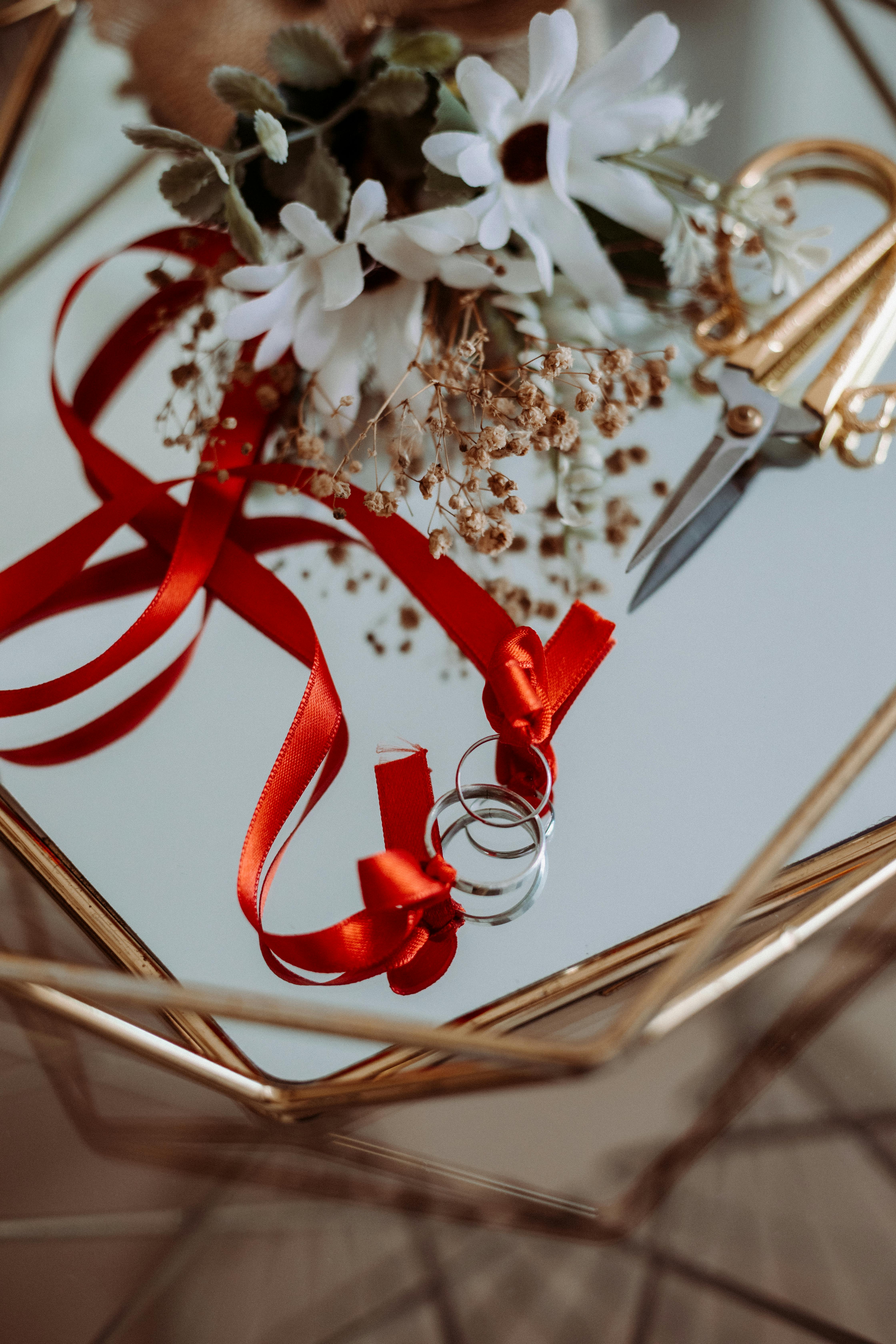 Rings on a Red Ribbon · Free Stock Photo