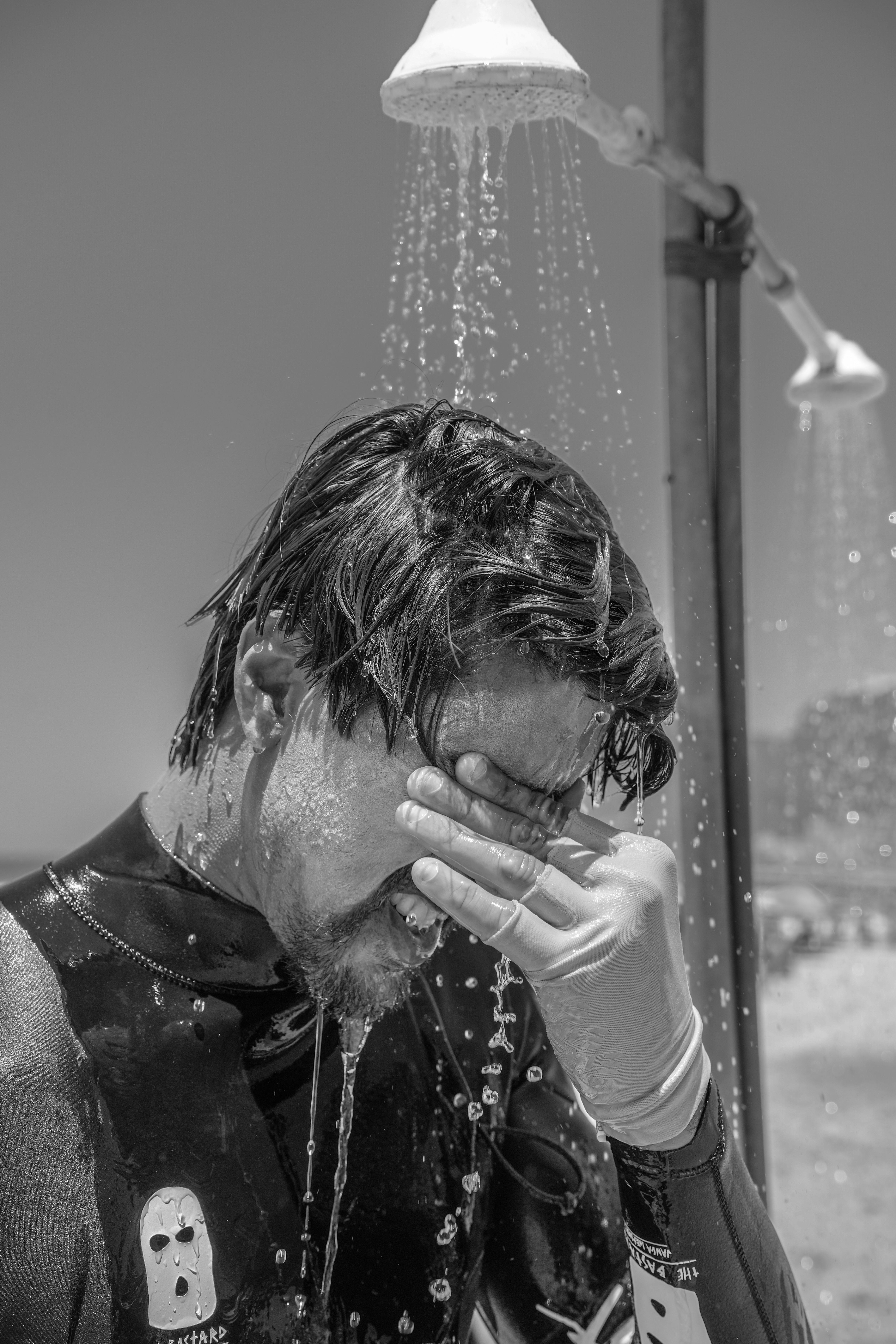 Man Under a Shower in Black and White · Free Stock Photo