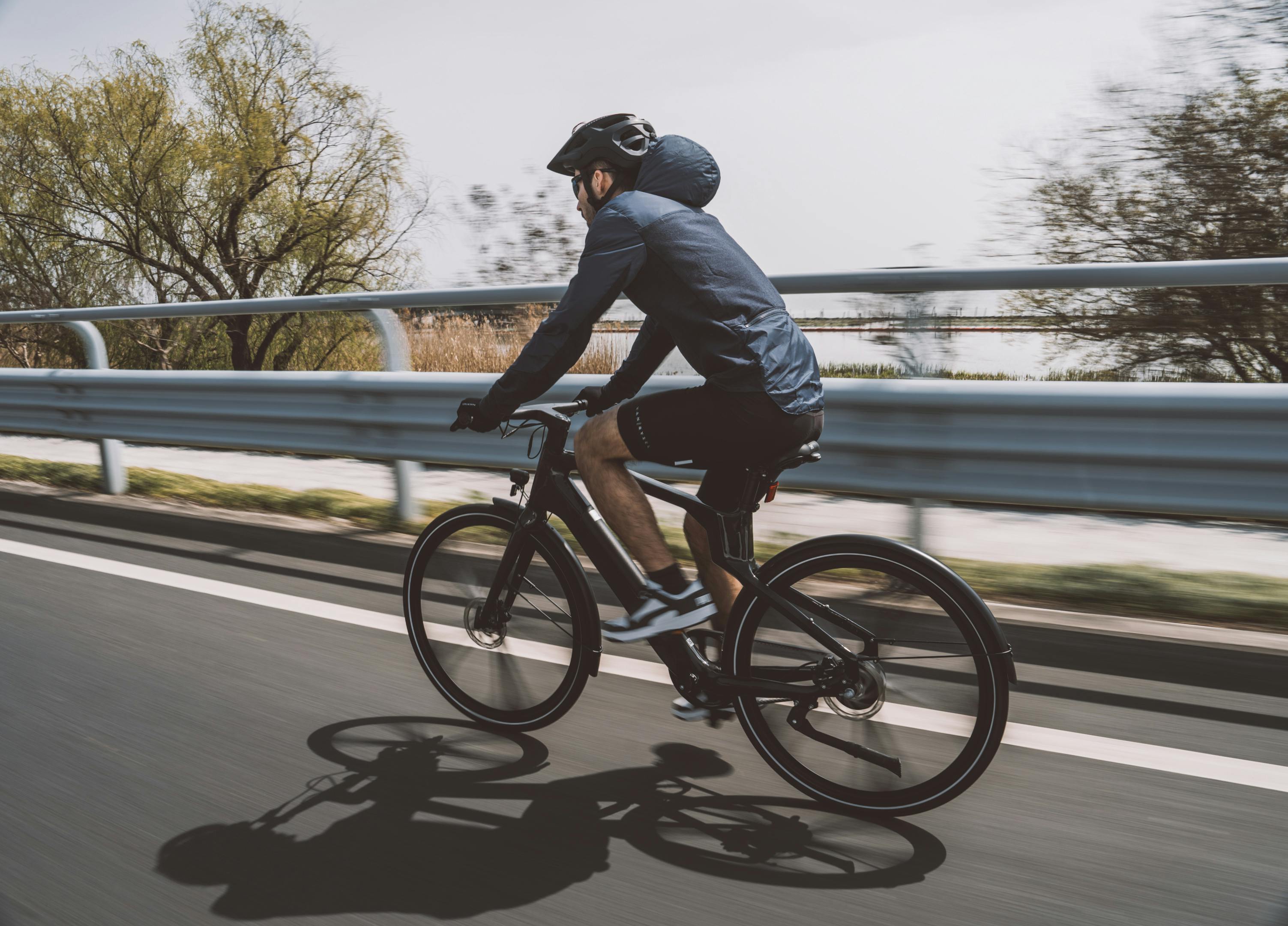 A person riding a bike on a highway · Free Stock Photo