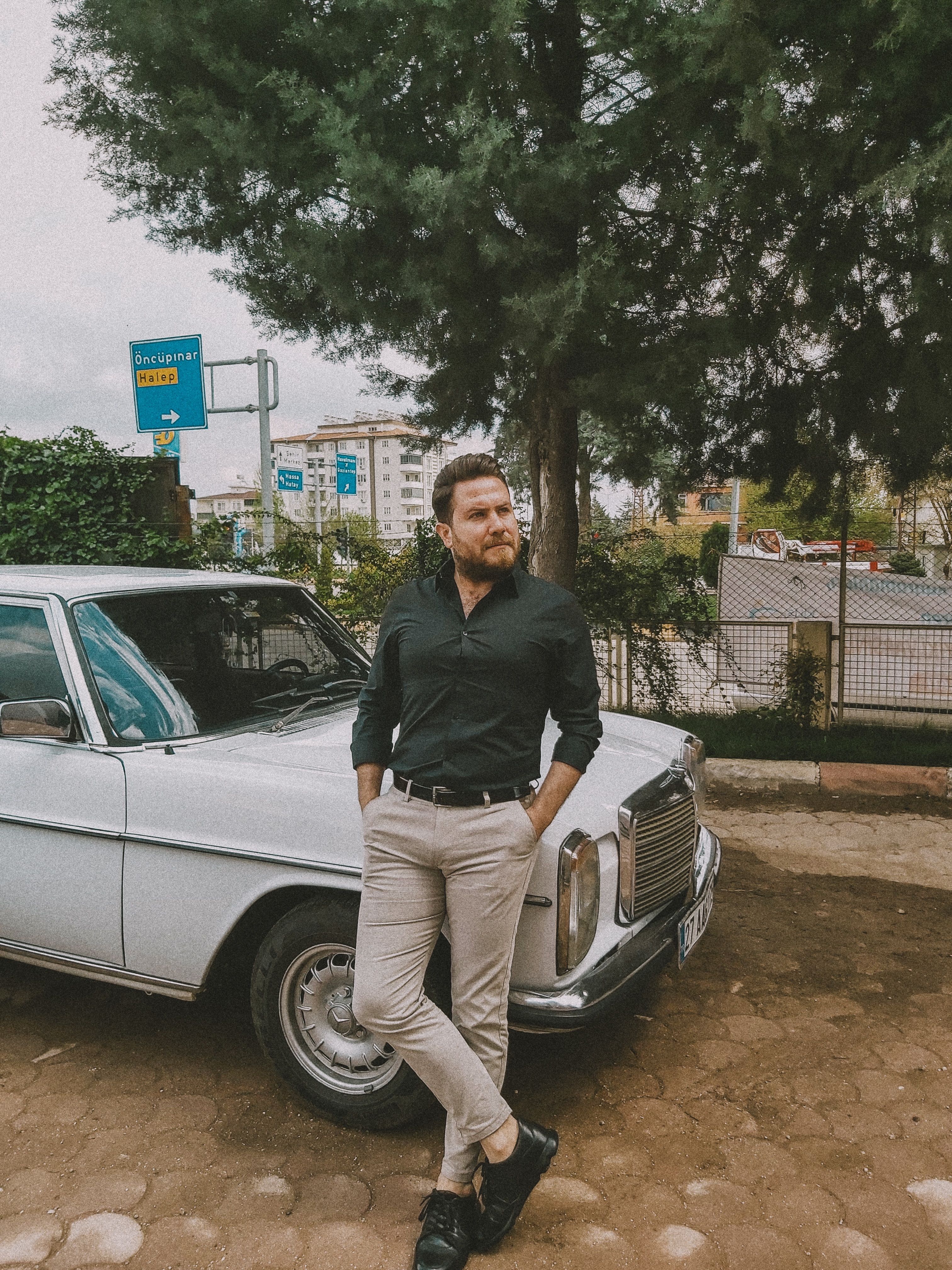 A Man Standing by a Car · Free Stock Photo
