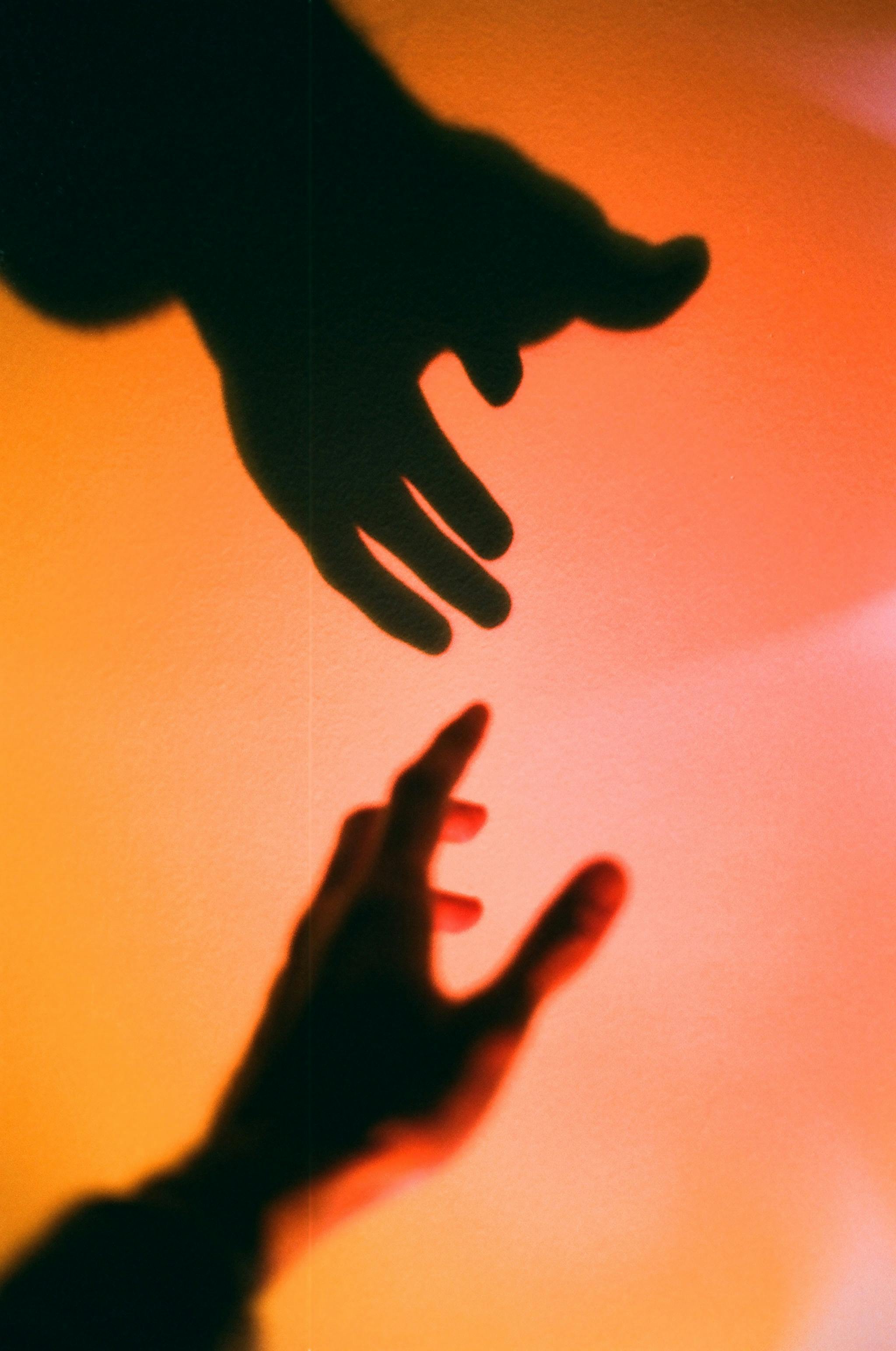 Man's Hand in Shallow Focus and Grayscale Photography · Free Stock Photo
