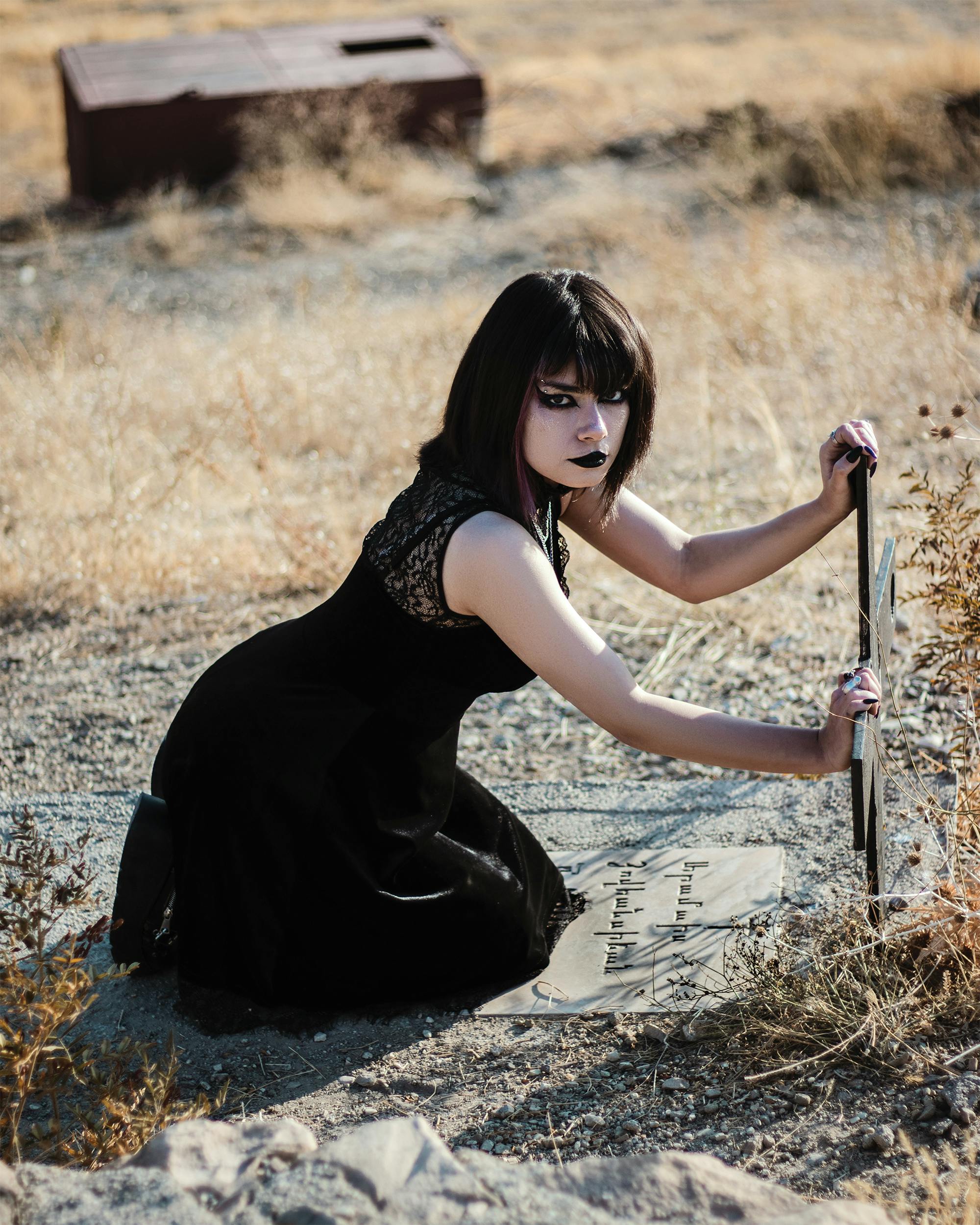 Woman in Red Dress Kneeling and Posing · Free Stock Photo