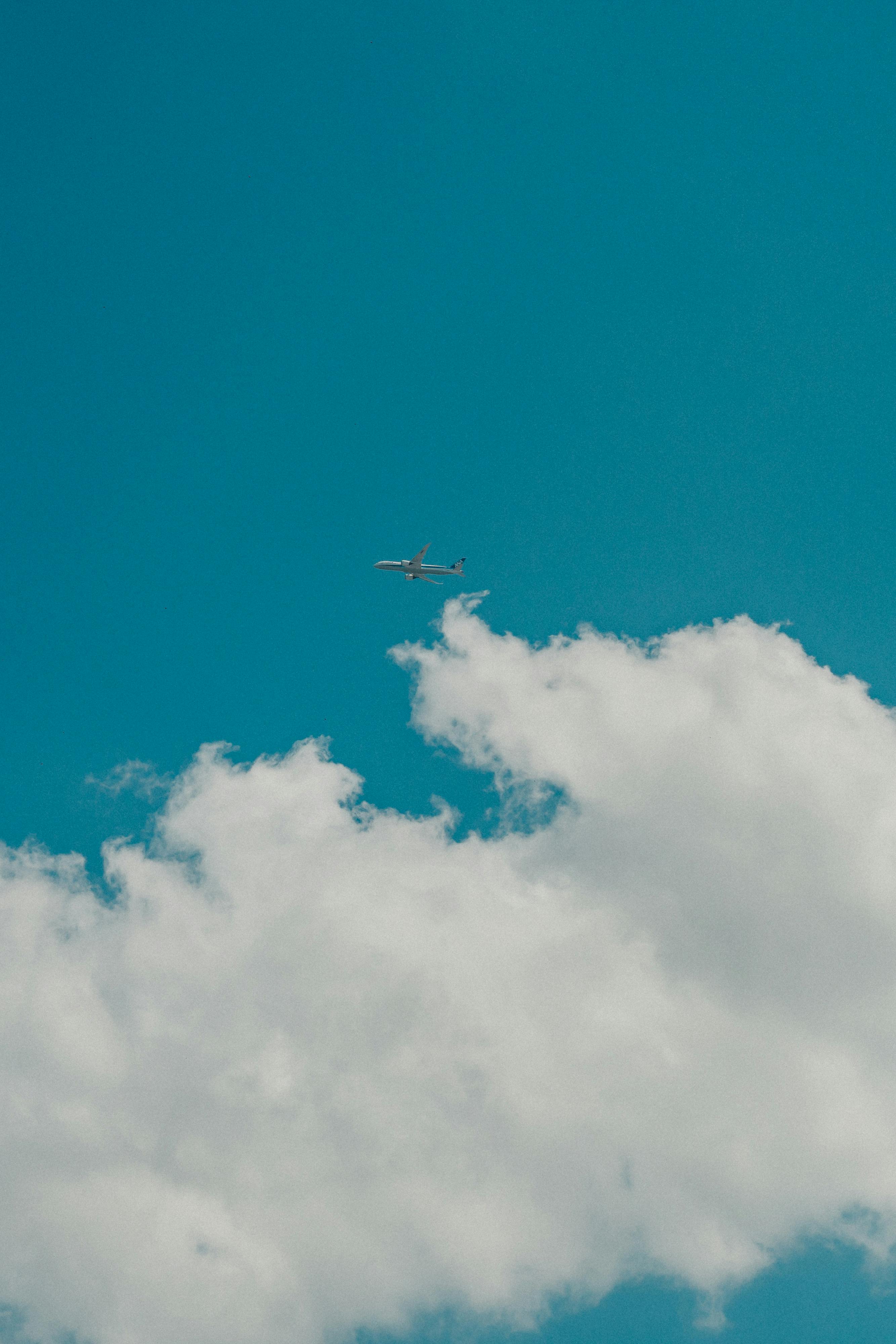 Airplane Flying over Cloud · Free Stock Photo