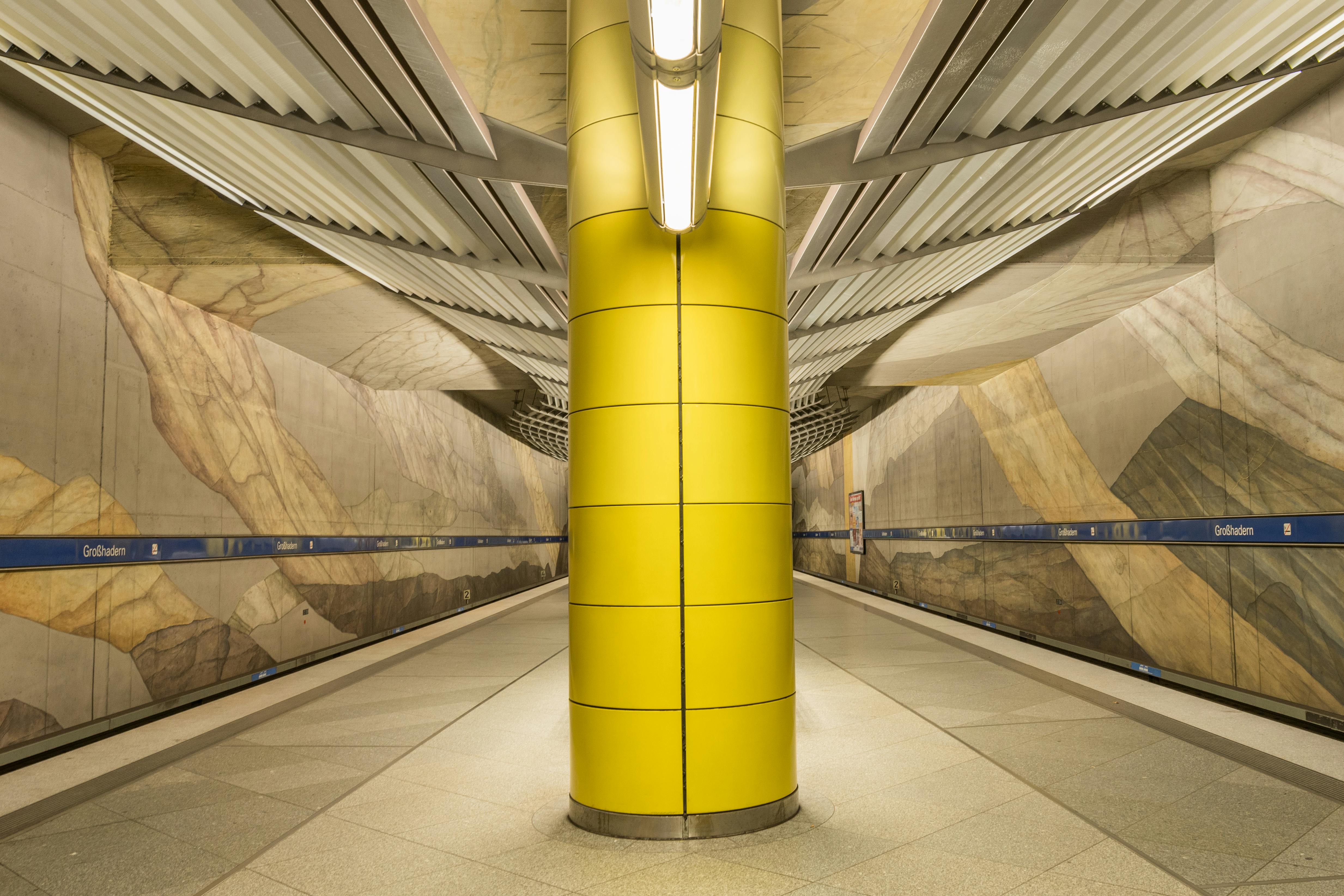 Empty subway station with dirty columns and railroad · Free Stock Photo