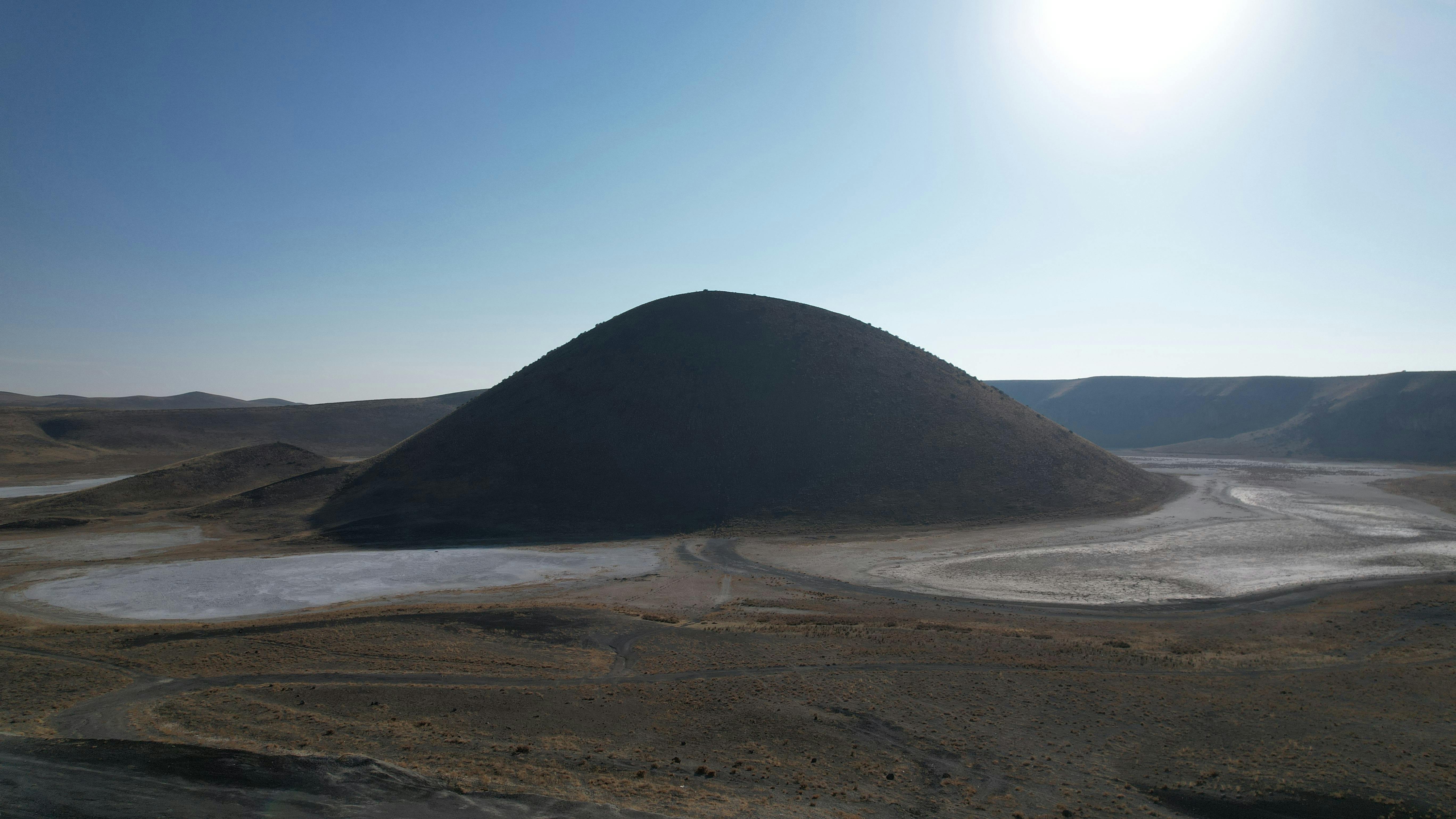Astronauts Holding Hands on a Desolate Planet · Free Stock Photo