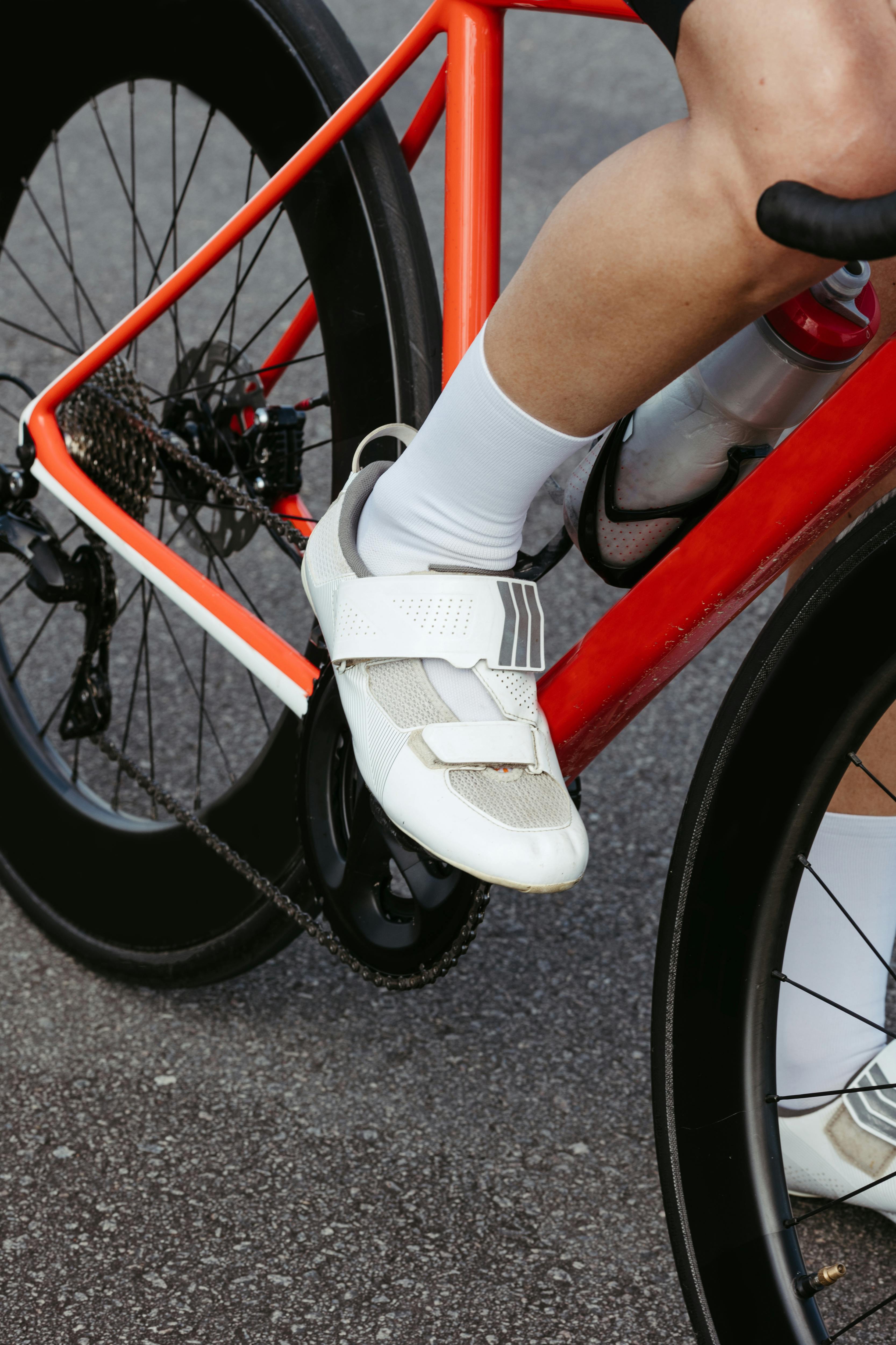 A close up of a person's feet on a bike · Free Stock Photo