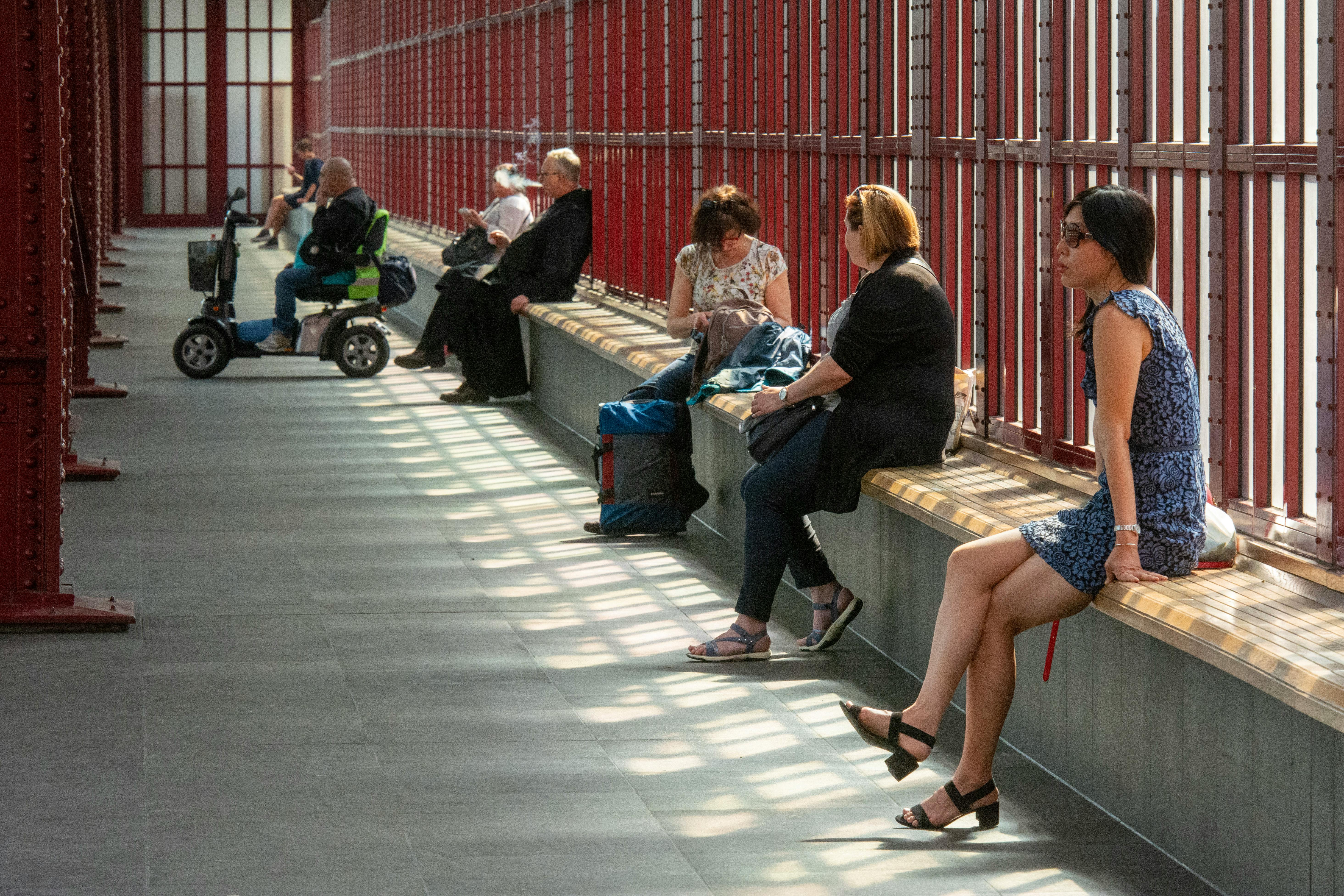 People Sitting on Outdoor Benches · Free Stock Photo