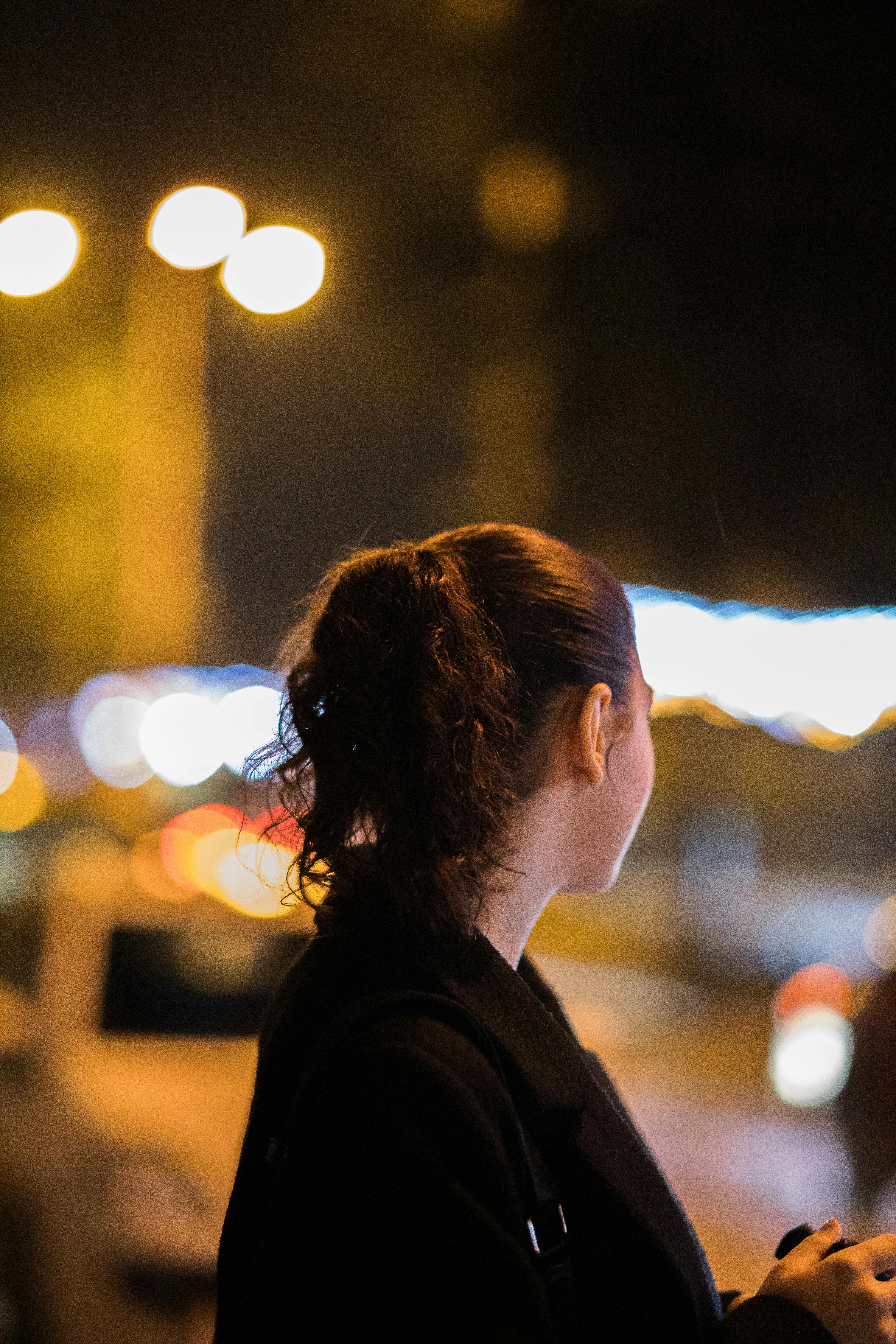 Brunette Woman on a Street at Night · Free Stock Photo