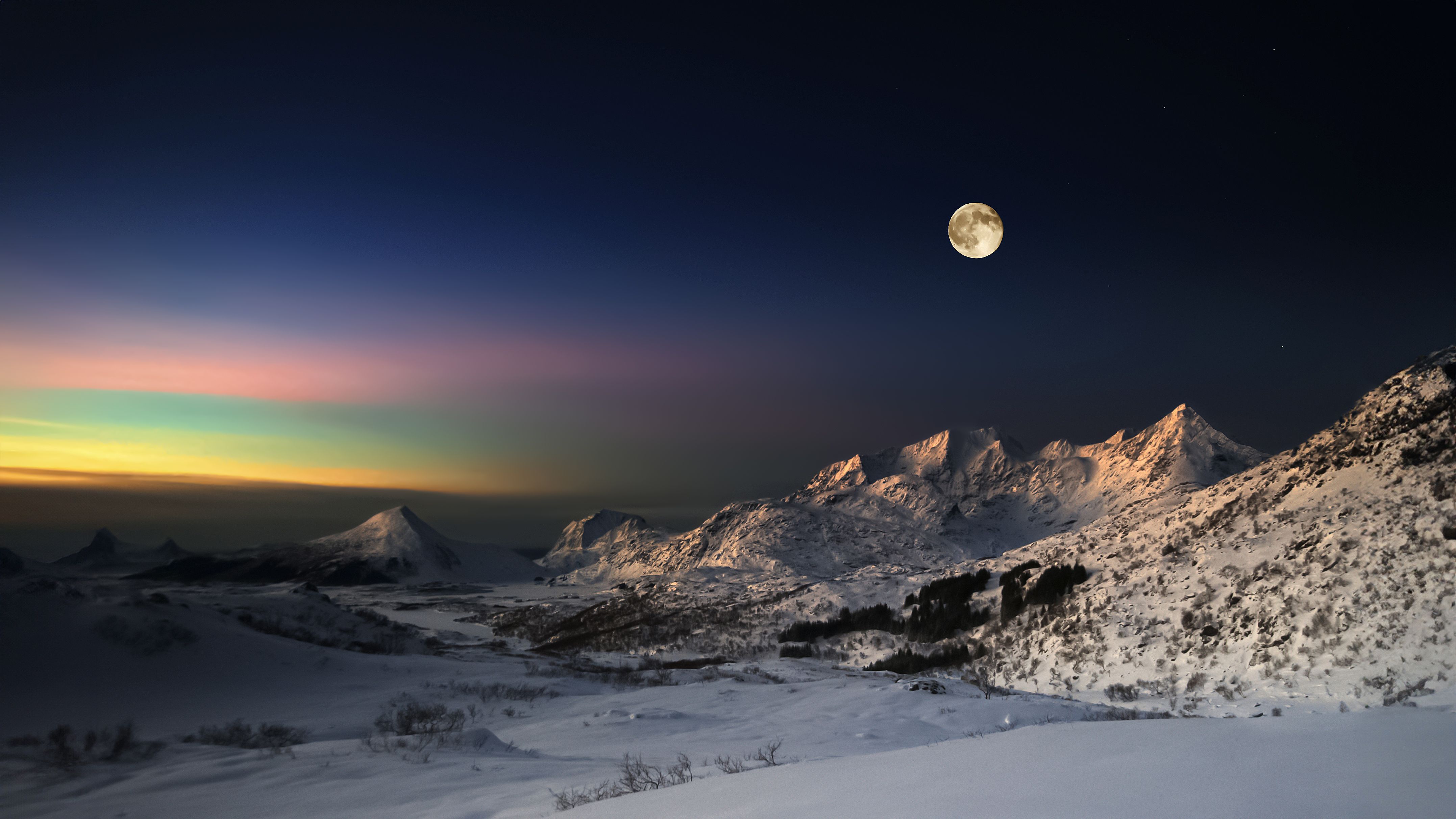 Scenic View of Snowy Mountains on the Shore under a Sunset Sky with ...