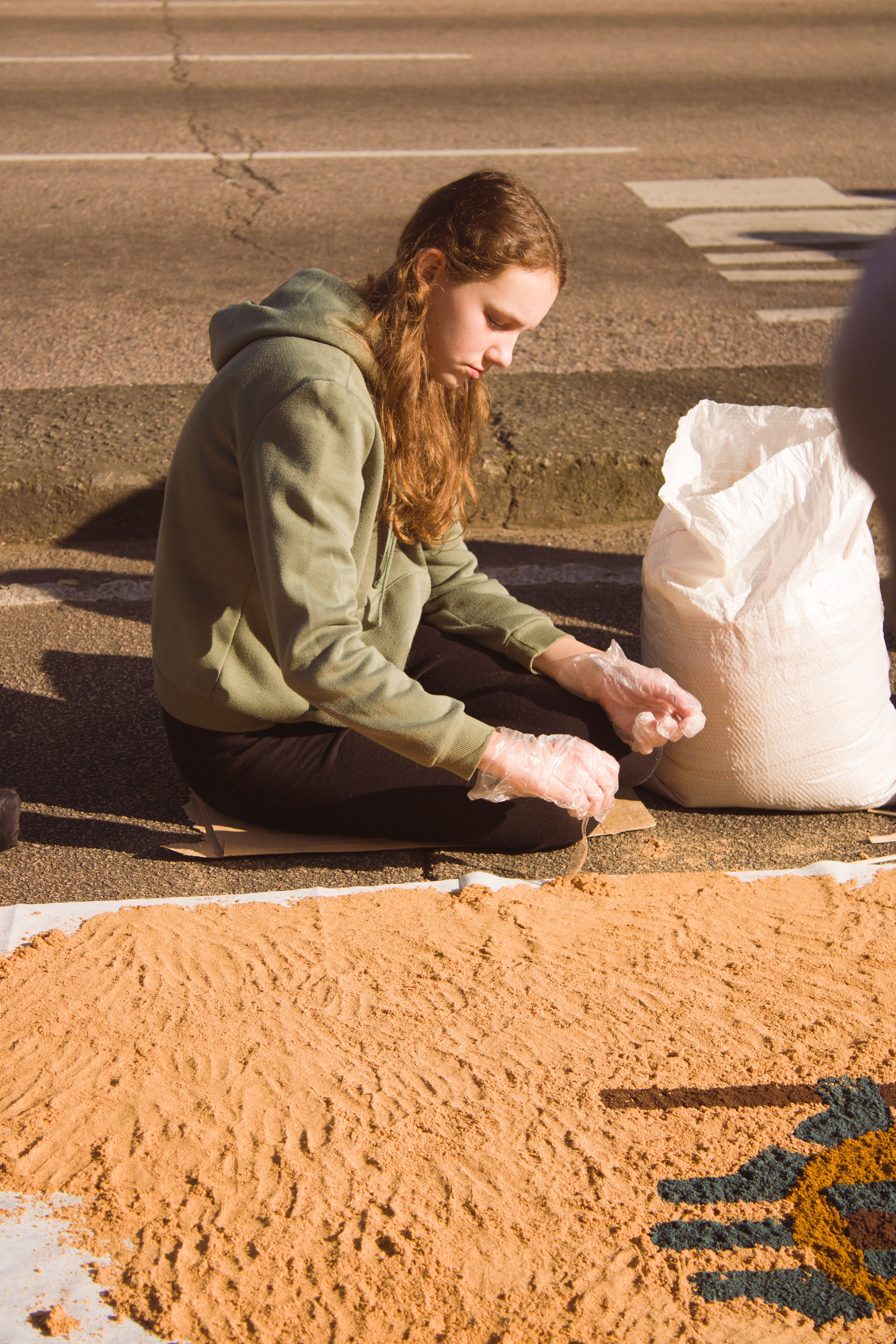 Teenager Creating Art in Sand · Free Stock Photo