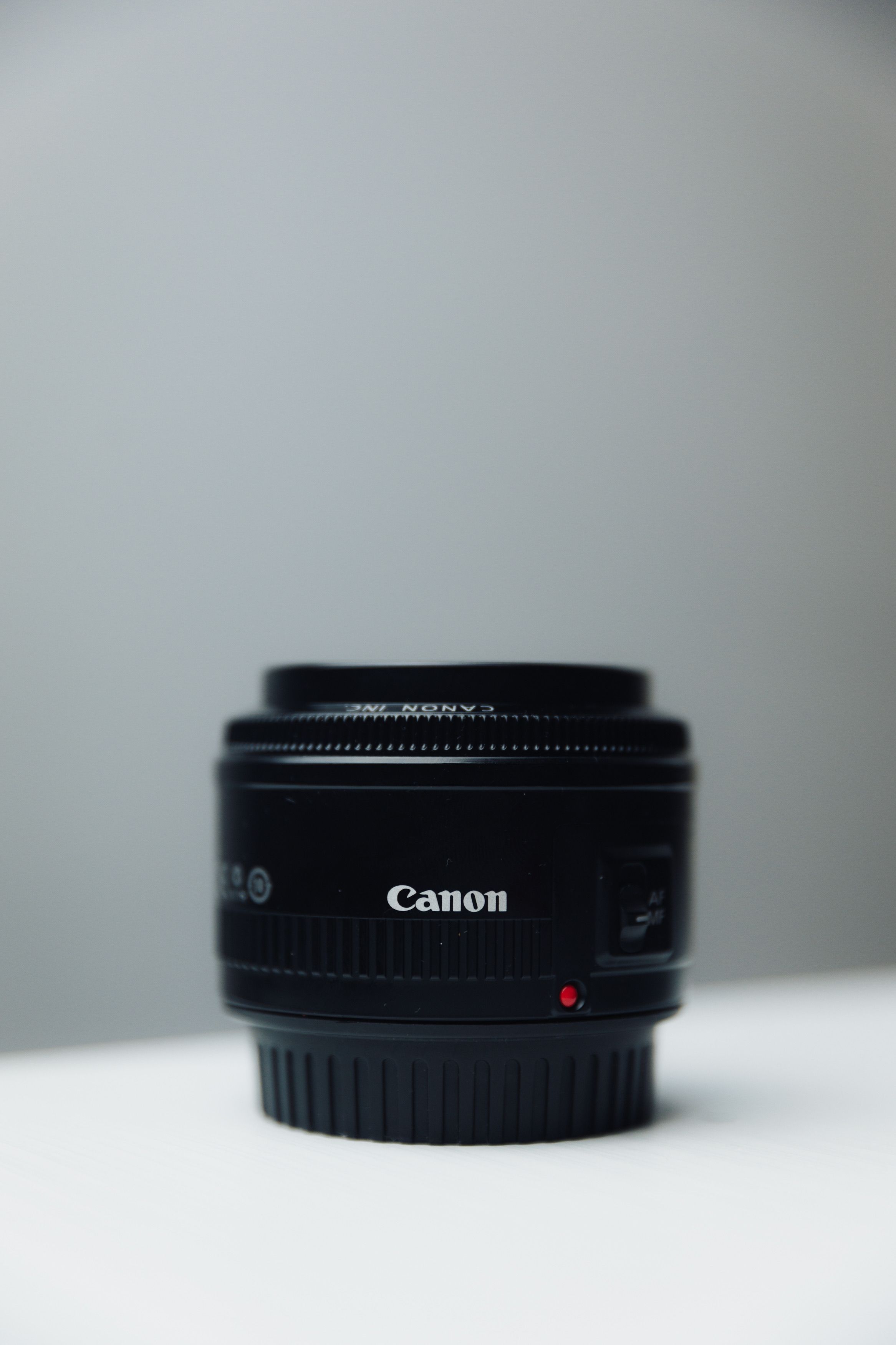Canon Lens on Table · Free Stock Photo