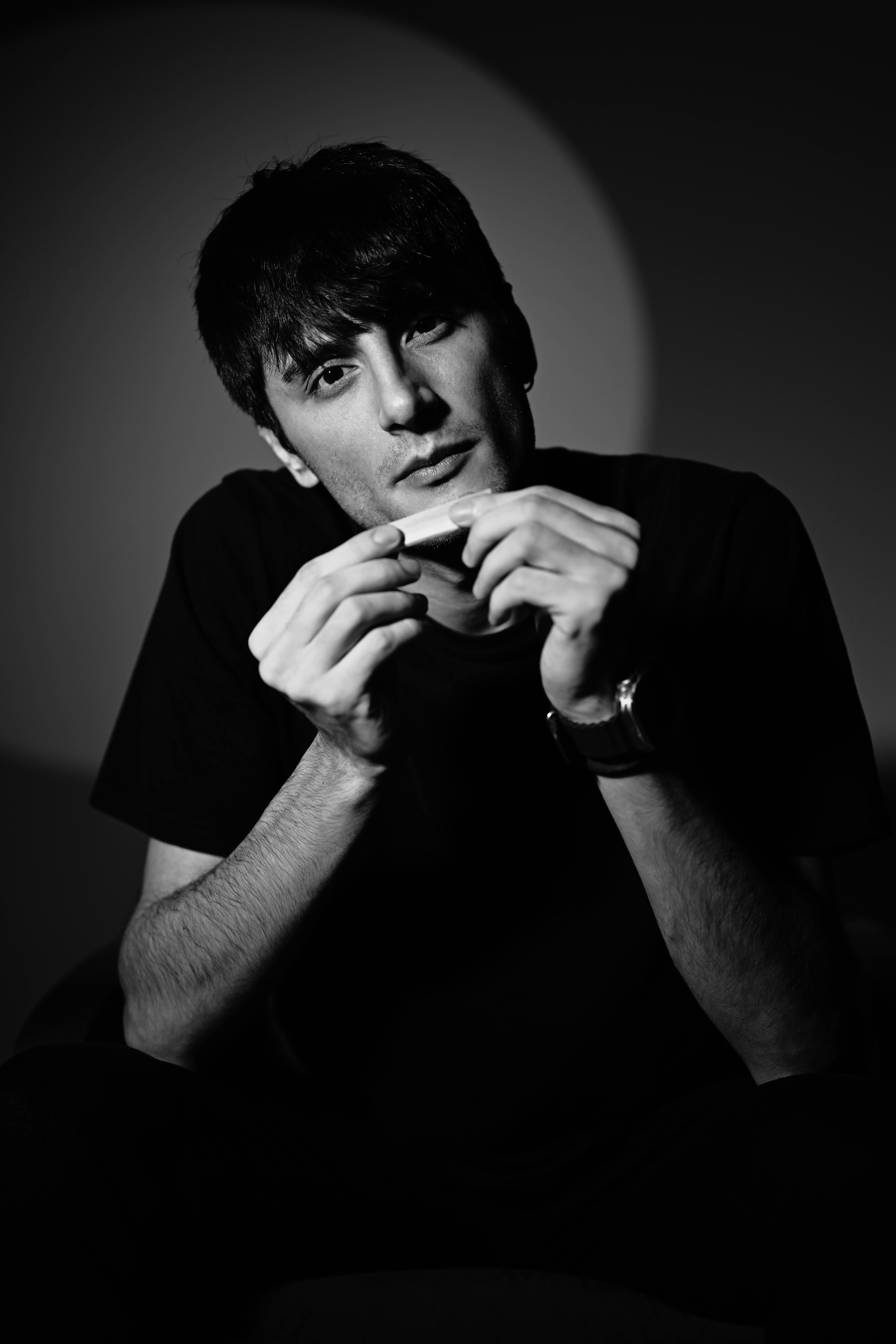 Black and White Photo of a Man Folding a Cigarette · Free Stock Photo