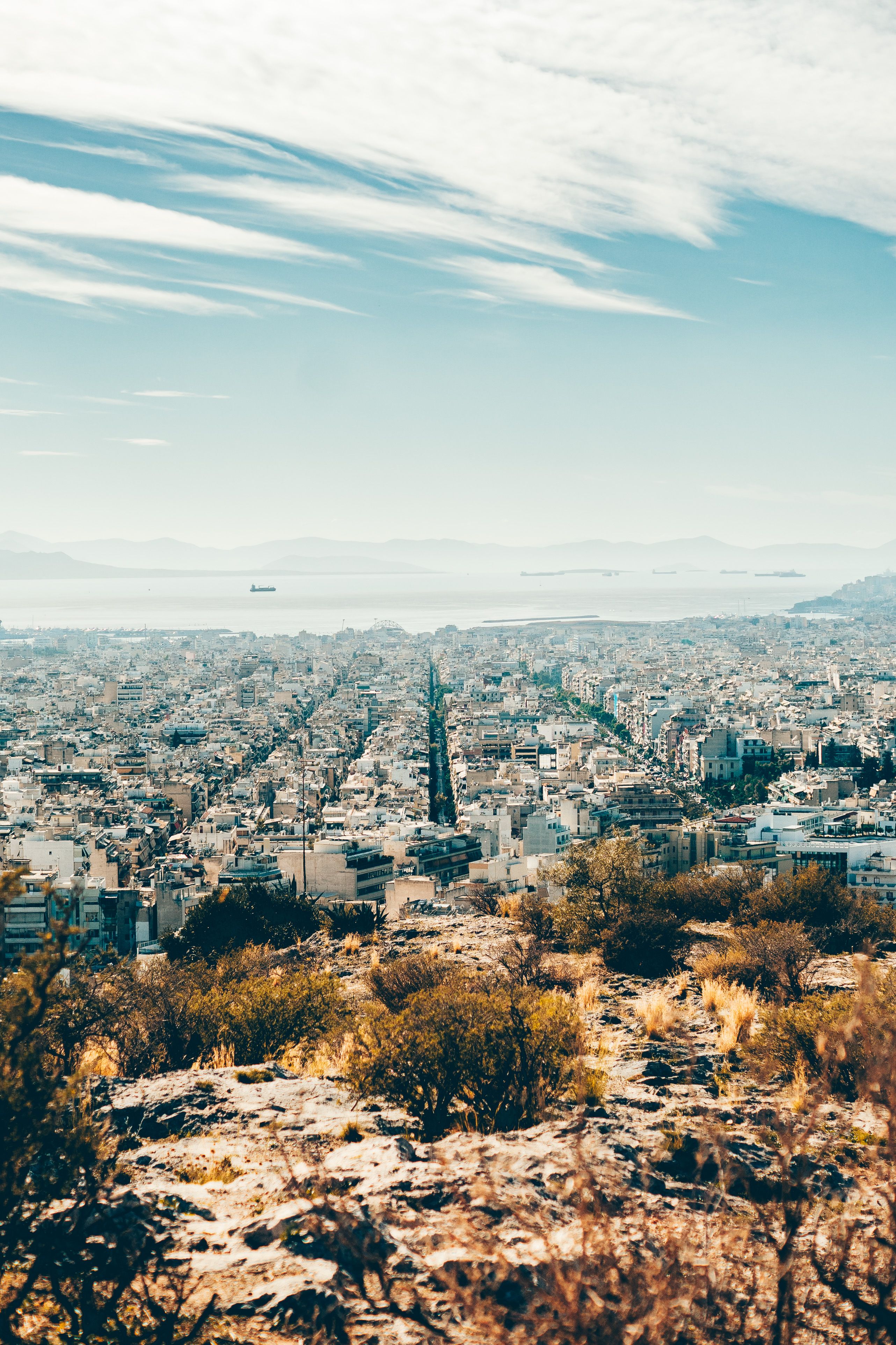The view from the top of a hill with a city in the distance · Free ...