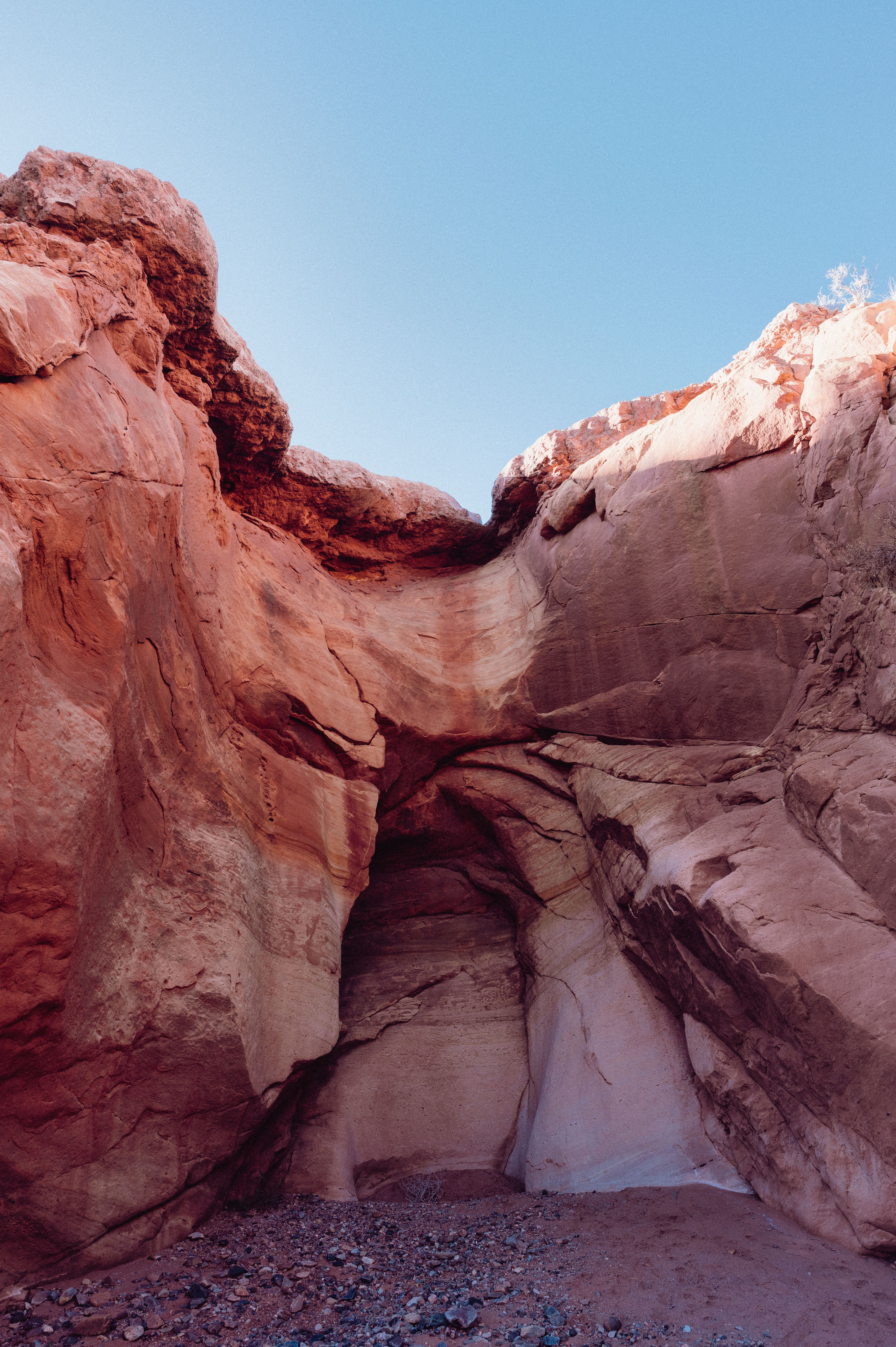 Close Up Photo of Black Rock Formation With Litter Amount of River in ...