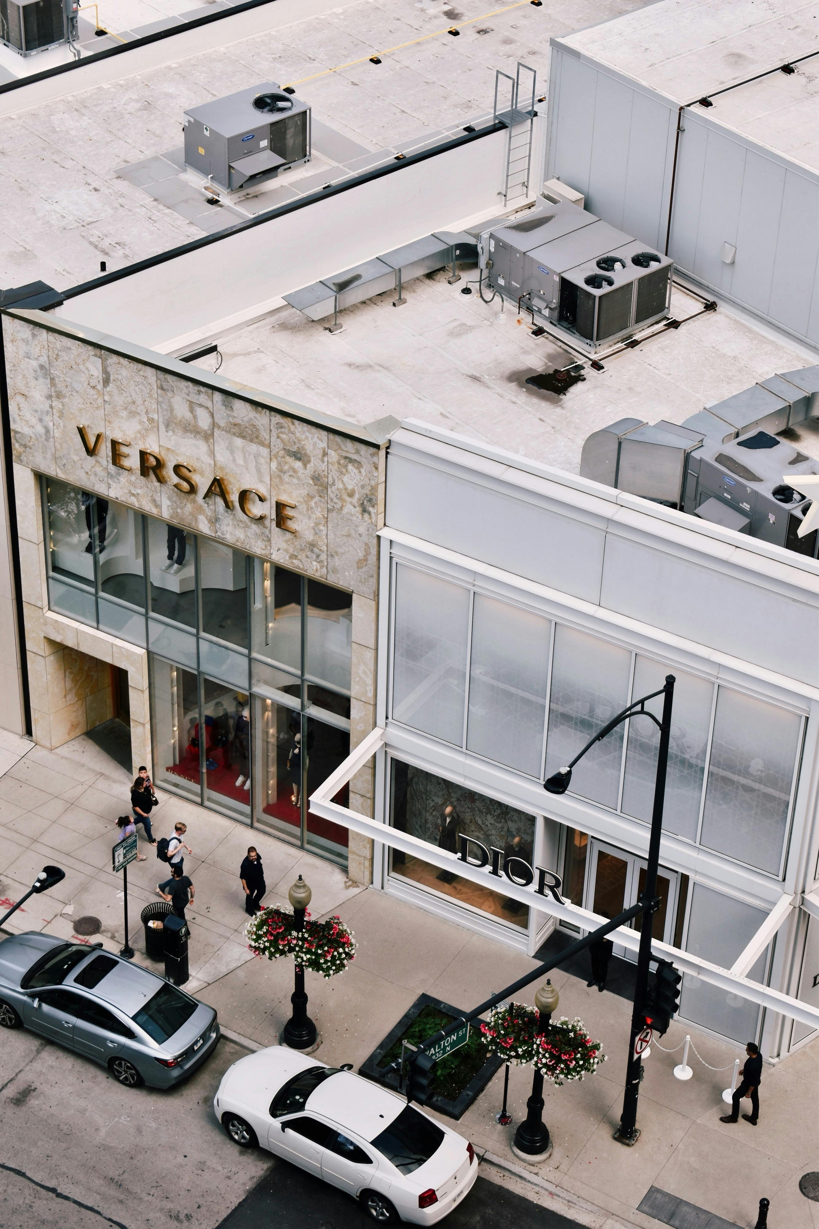 Aerial View of Luxury Brand Stores by the Street in City · Free Stock Photo