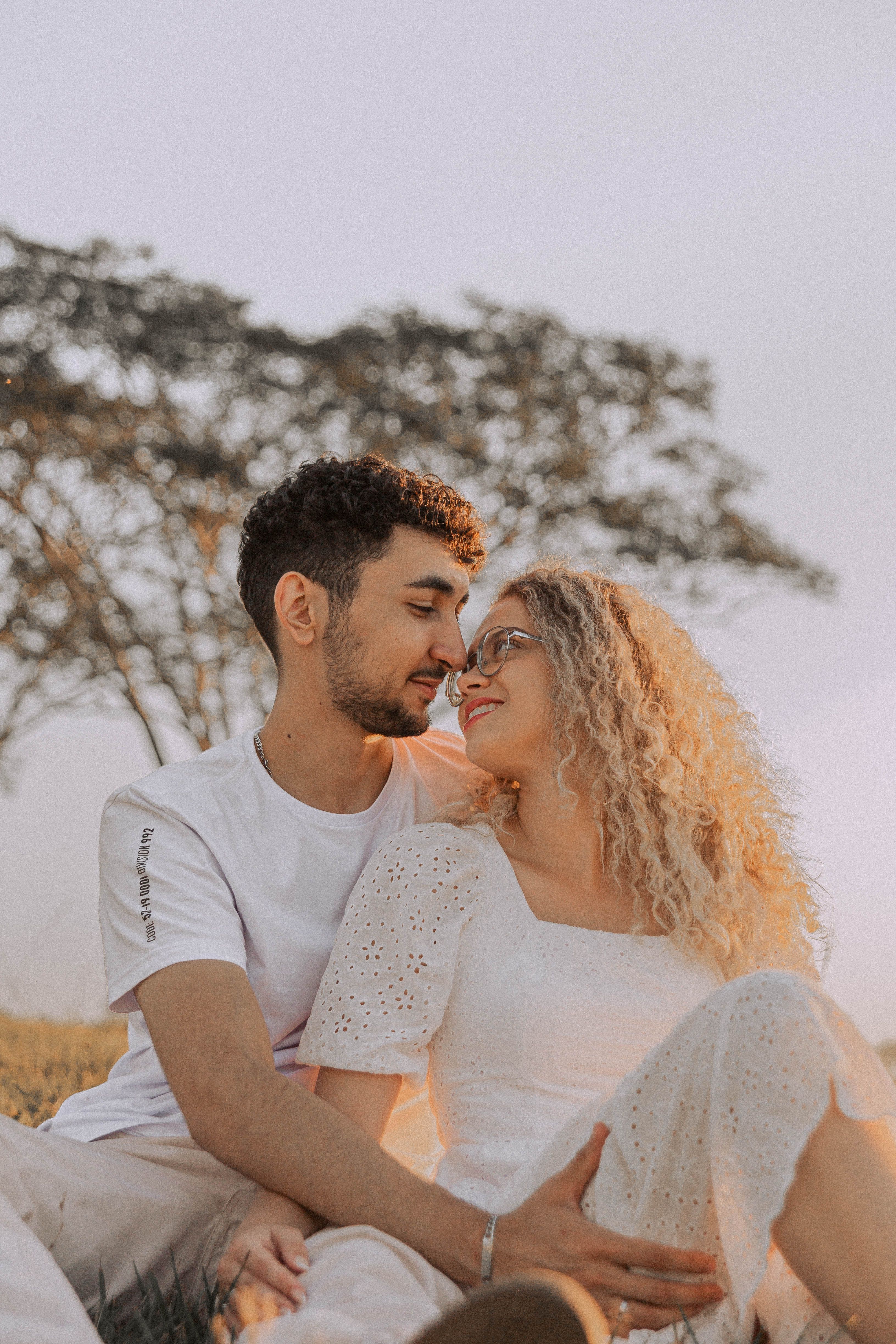Smiling Couple Sitting Together · Free Stock Photo