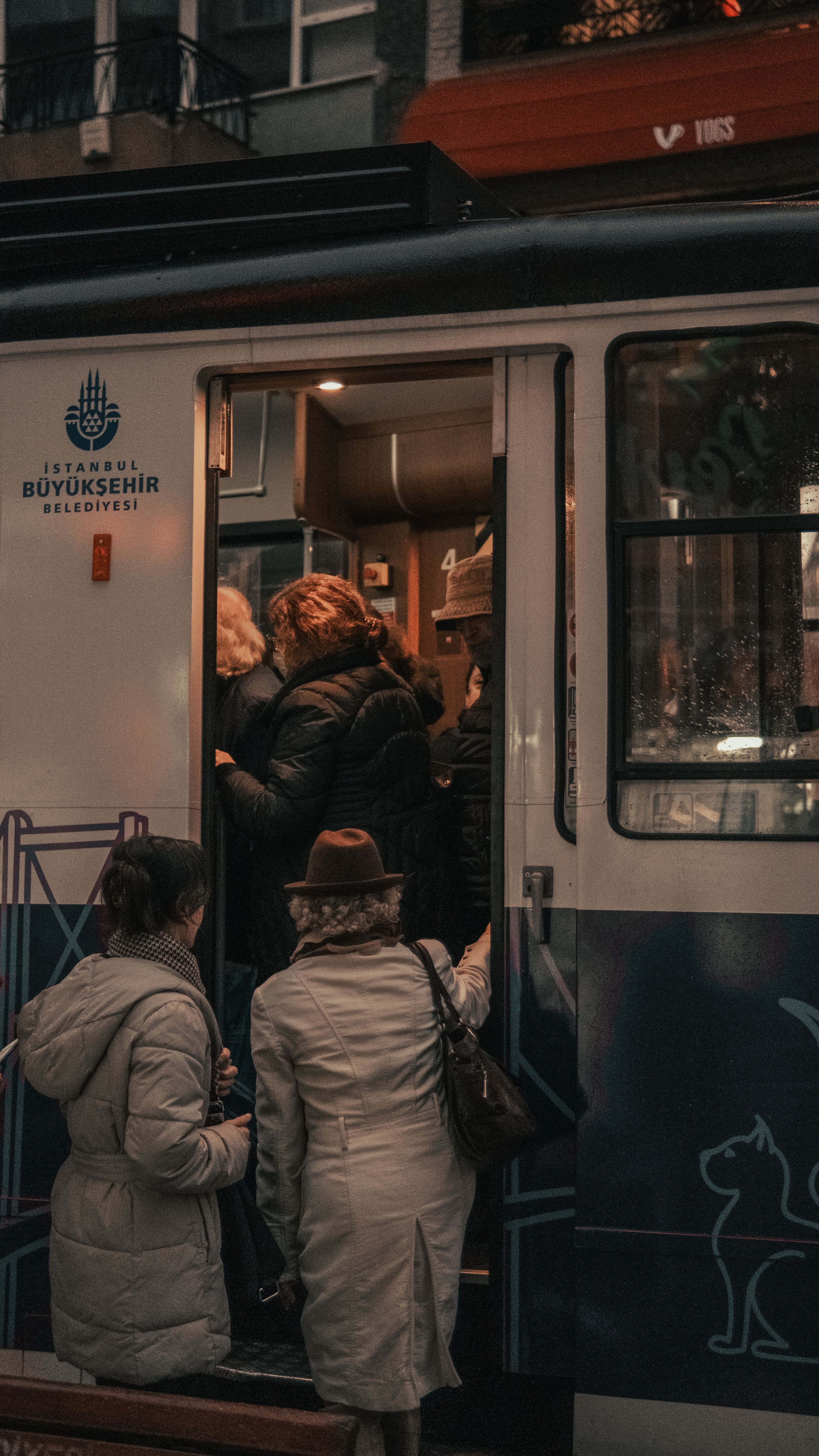 Women Entering Crowded Wagon · Free Stock Photo