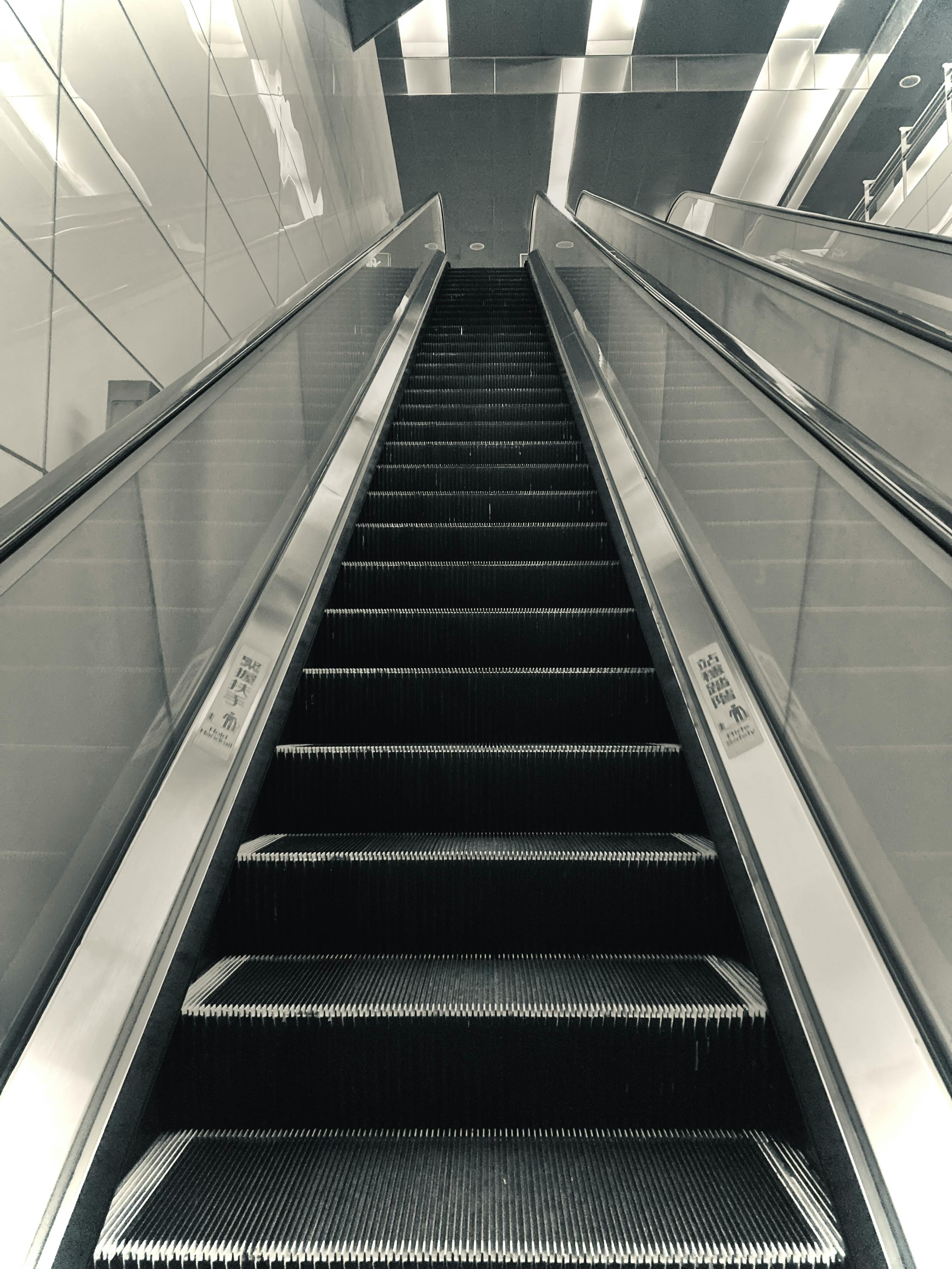 Shiny Steps and Hand Rails of an Escalator · Free Stock Photo
