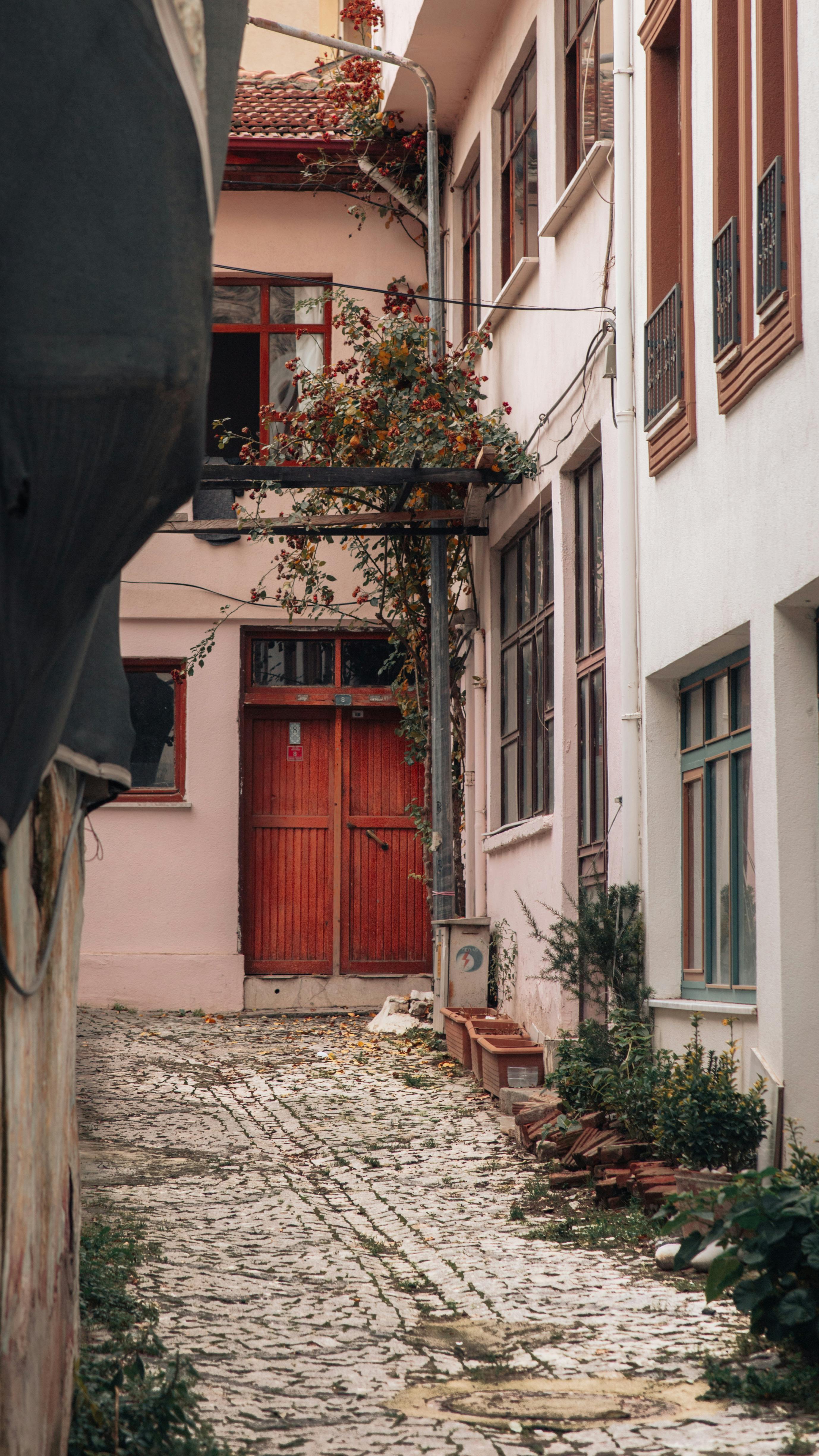 Photo of an Alley between Buildings · Free Stock Photo