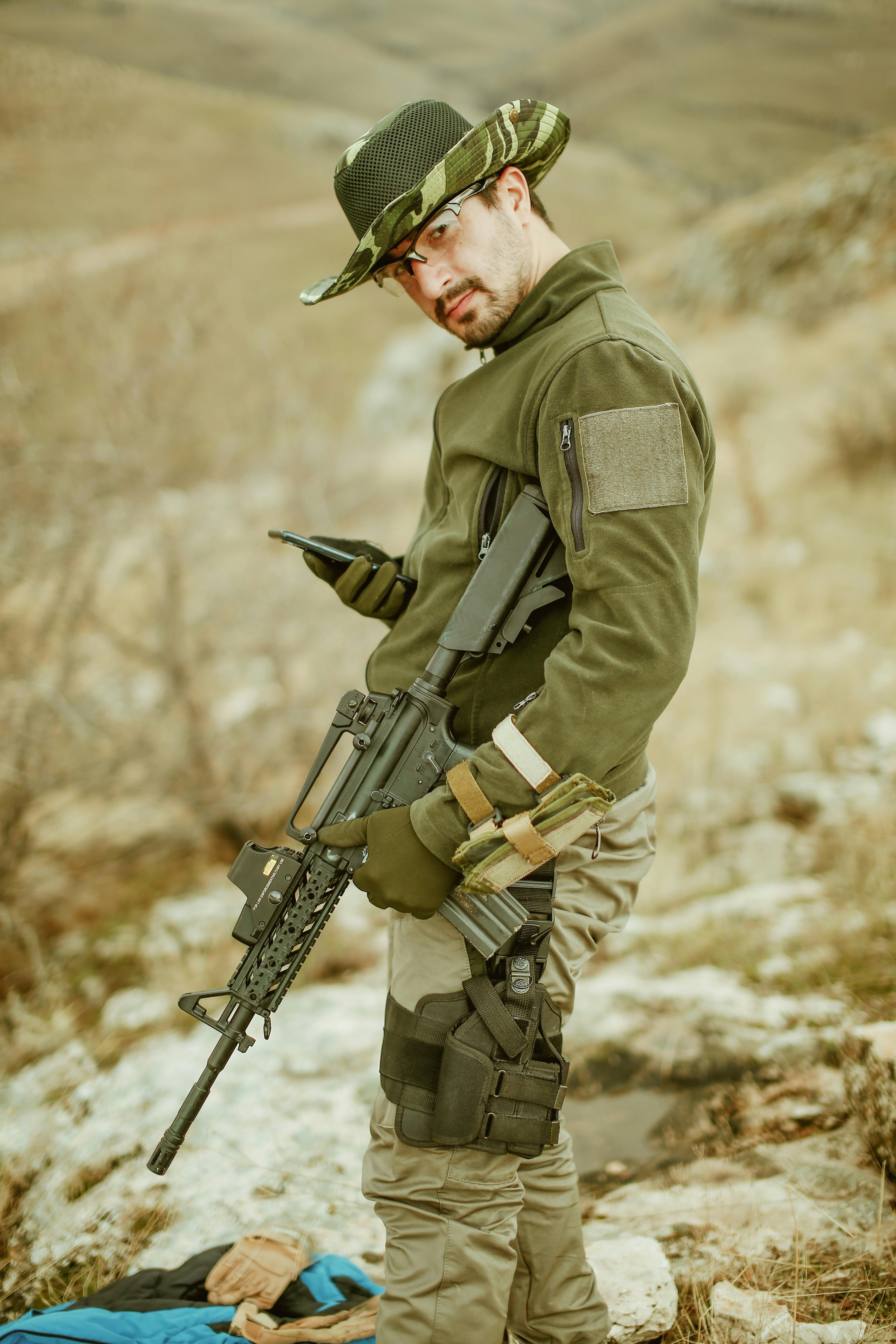 Black Metal Gun on White Surface · Free Stock Photo