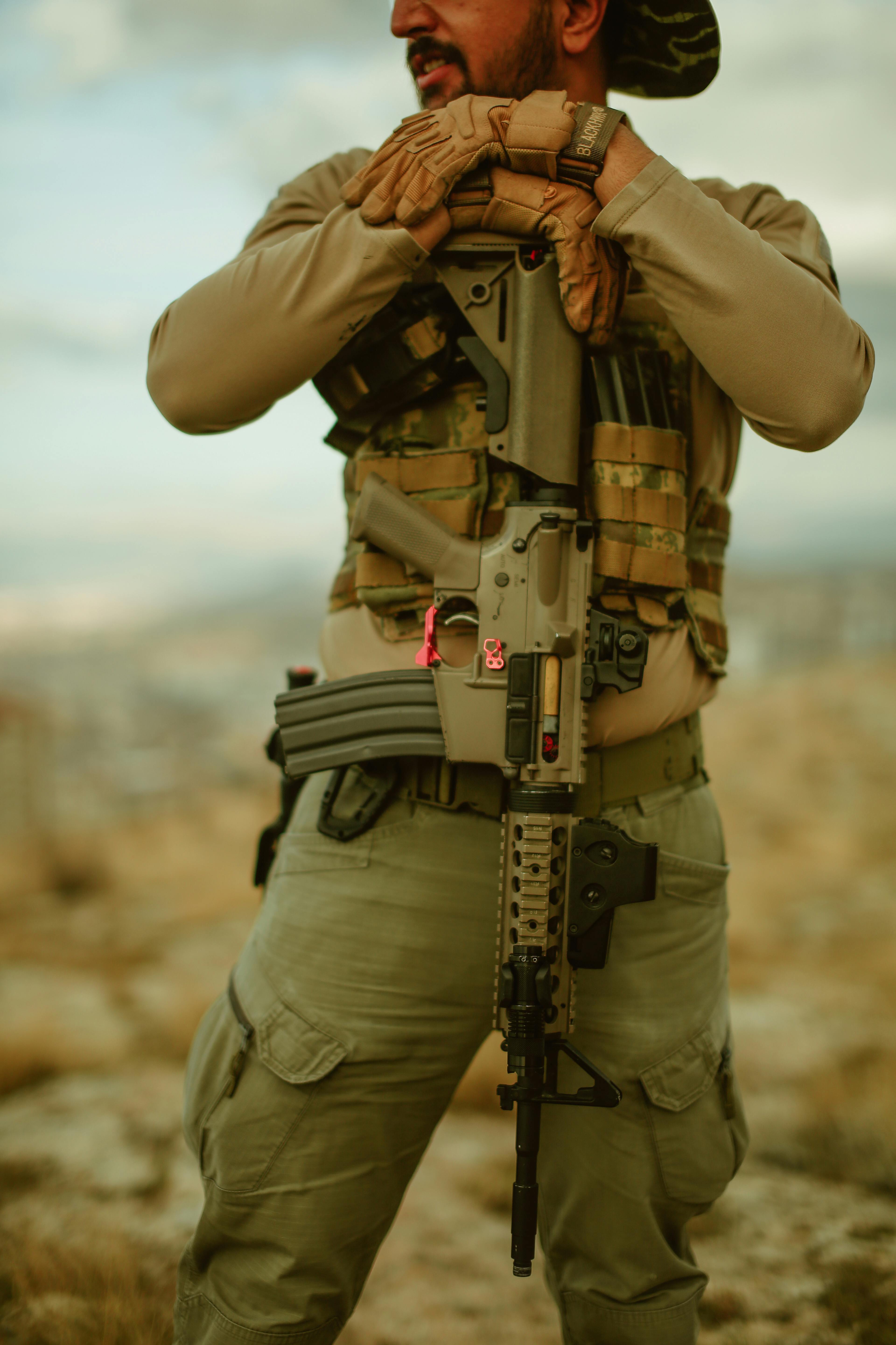 Military Weapon on Rocks · Free Stock Photo