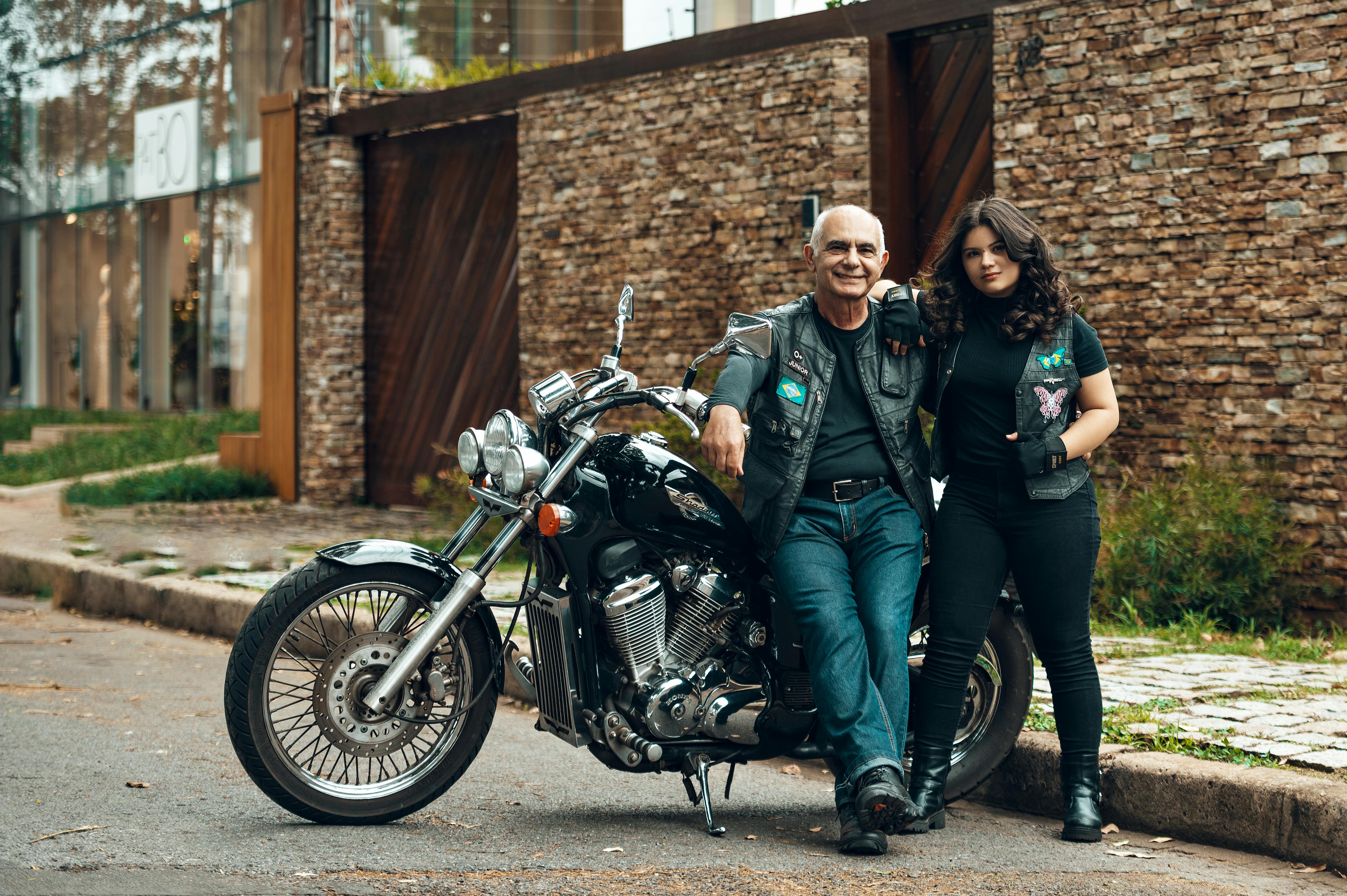 Father and Daughter Standing next to a Motorcycle and Smiling · Free ...