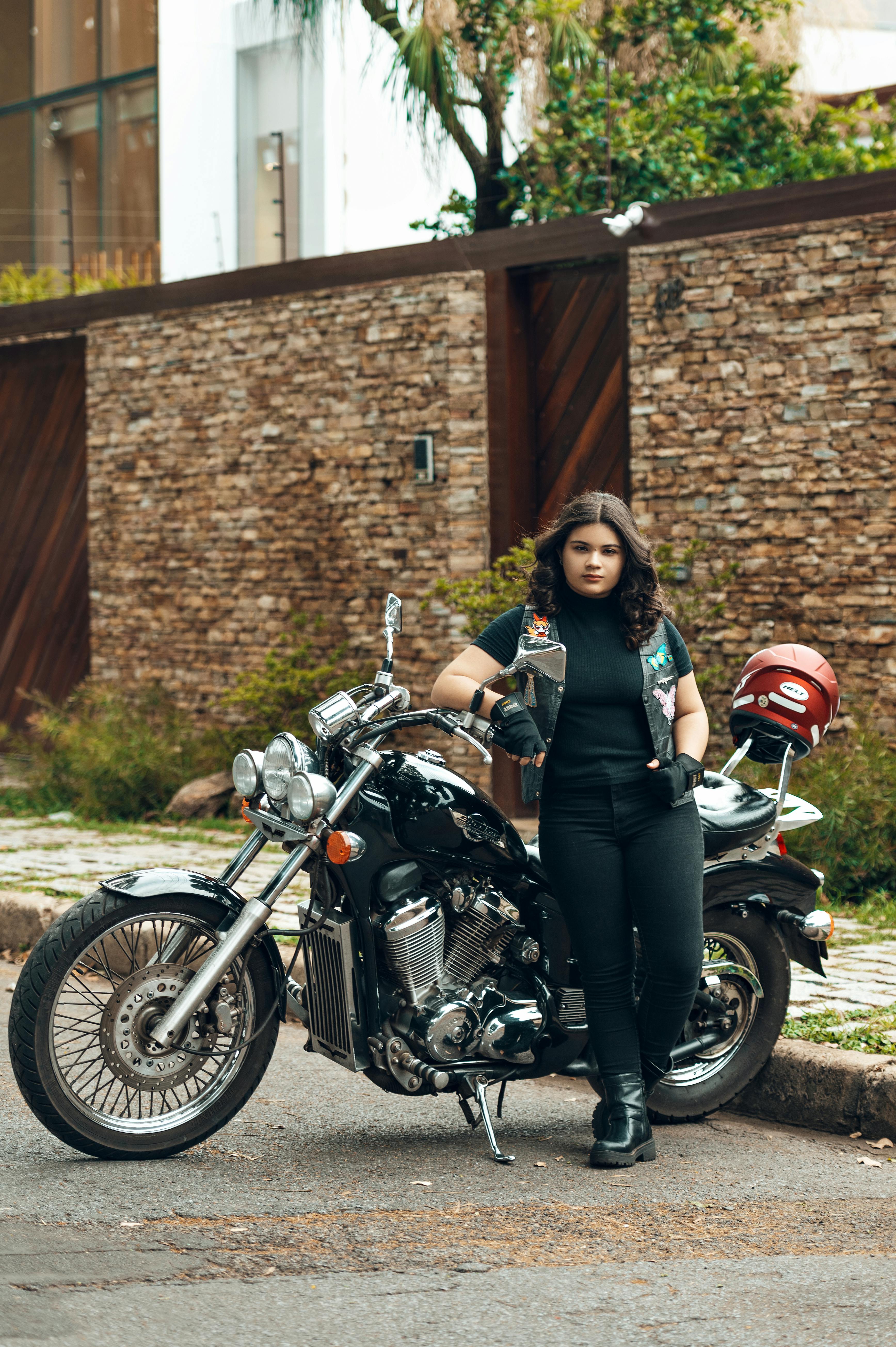 Young Woman Posing in front of a Motorcycle · Free Stock Photo