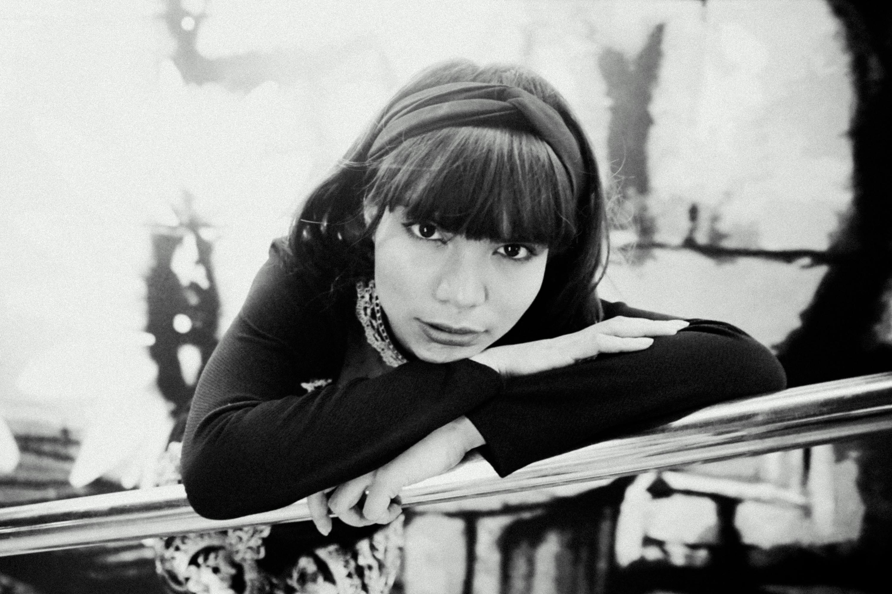 Black and White Photo of a Girl with Bangs Leaning on a Handrail · Free ...