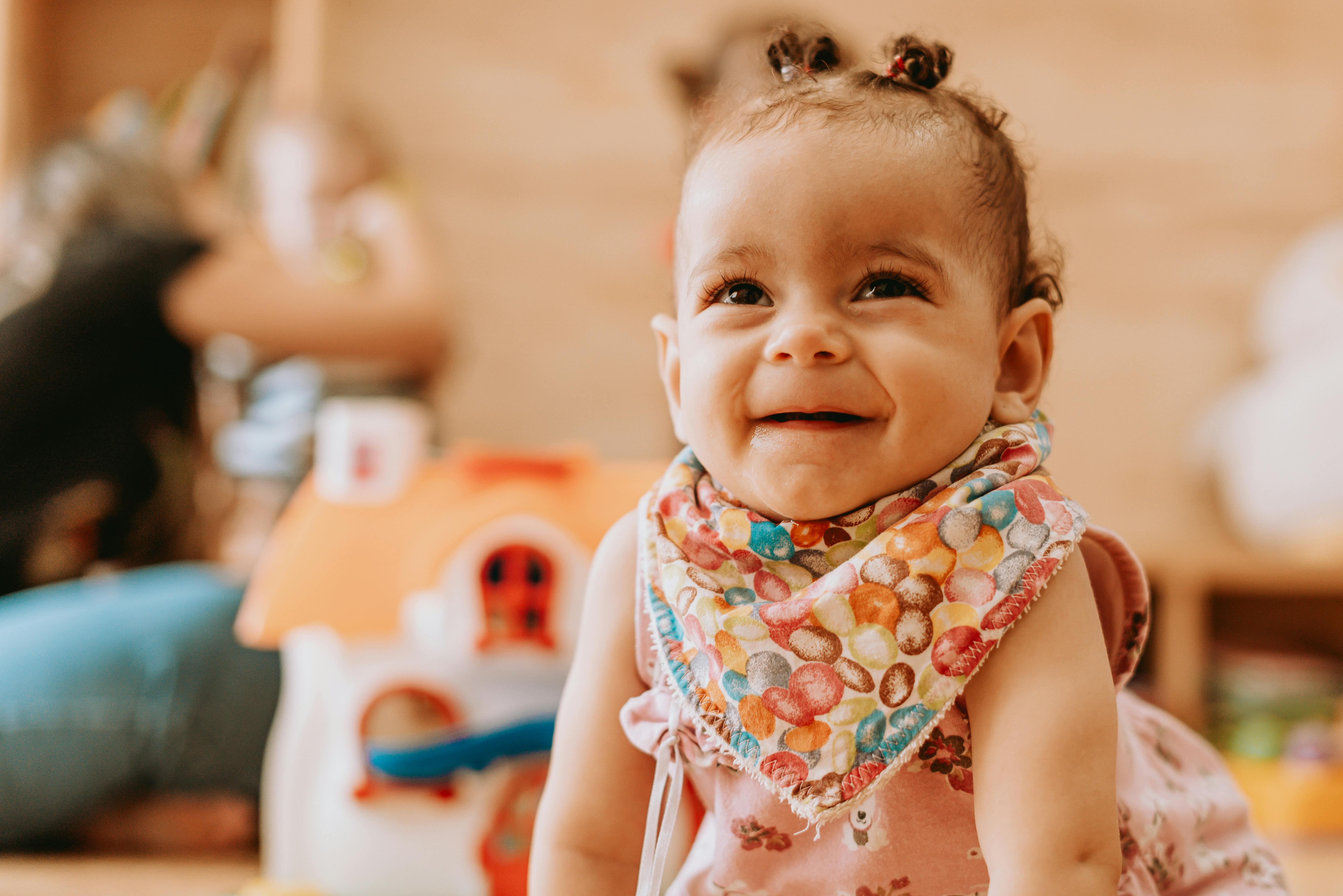 Smiling Girl in Bib · Free Stock Photo