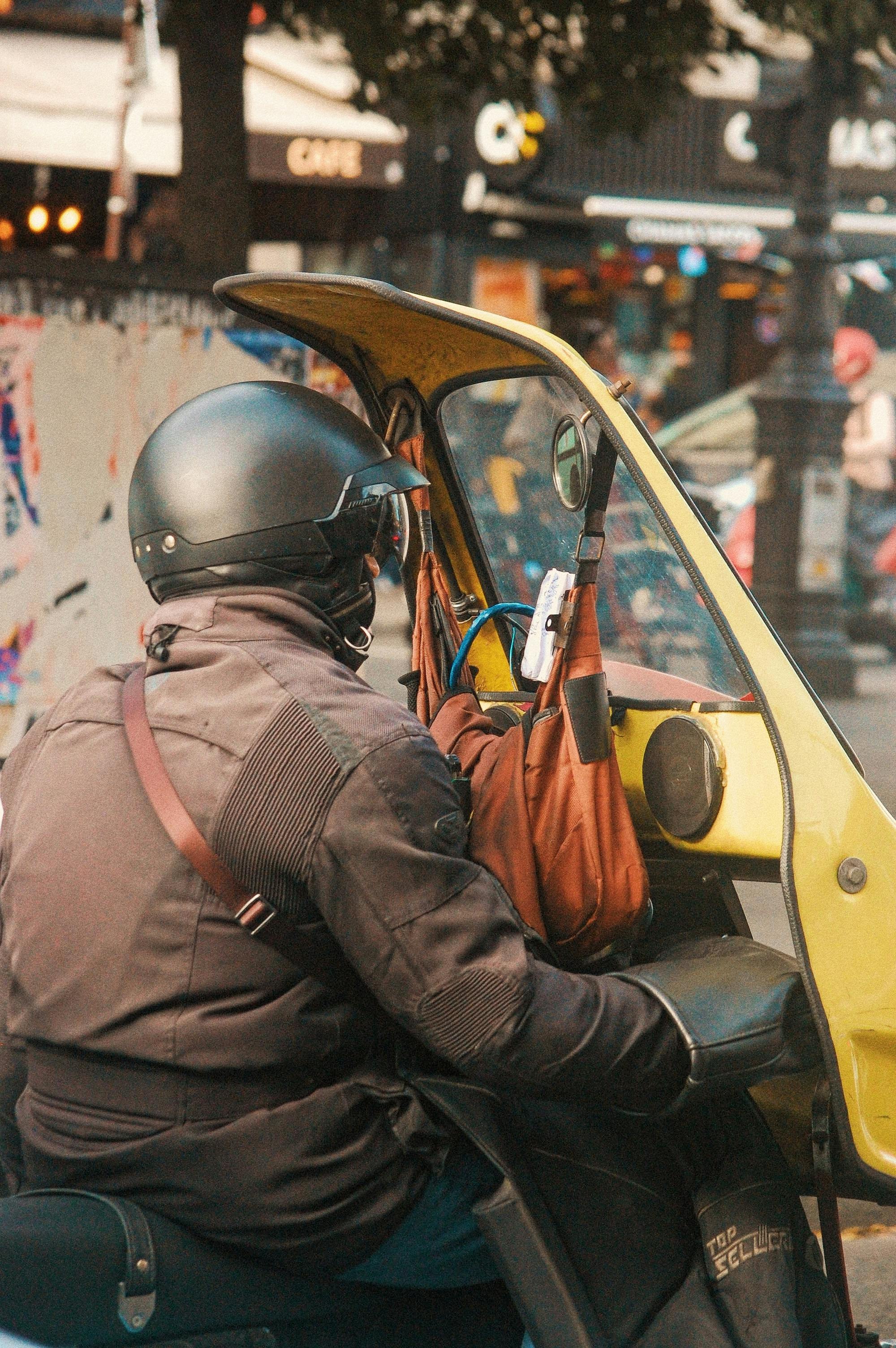 Man in Jacket and Helmet Riding Auto Rickshaw · Free Stock Photo