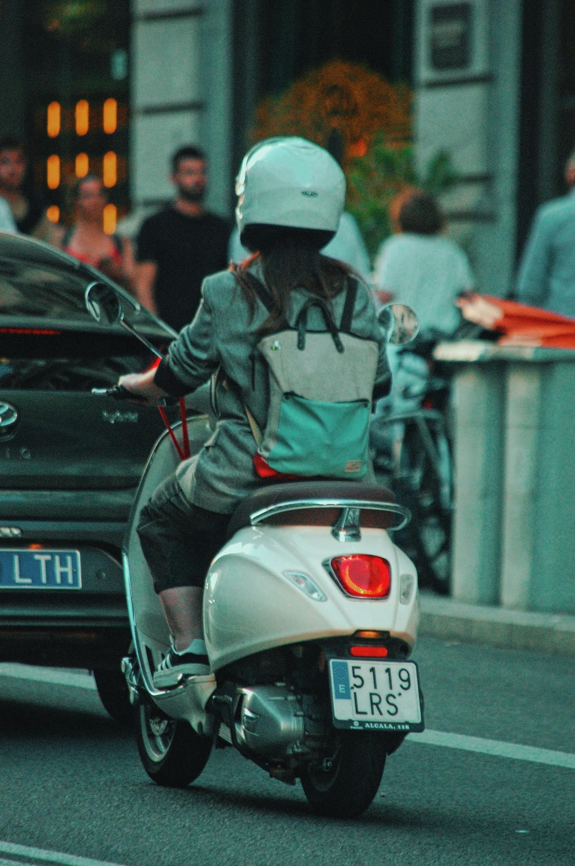 Woman Riding Vespa