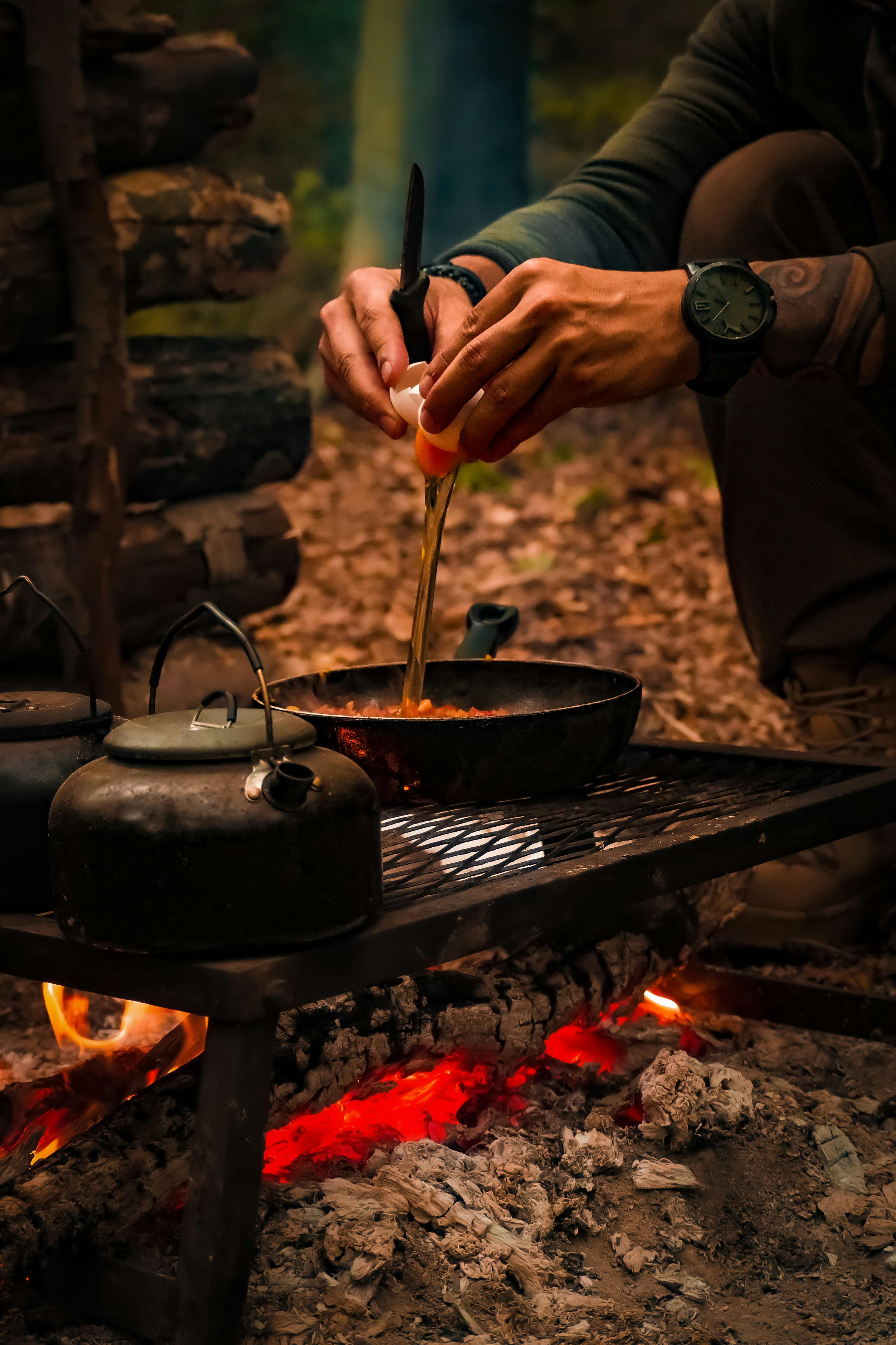 Man Cooking in Forest · Free Stock Photo