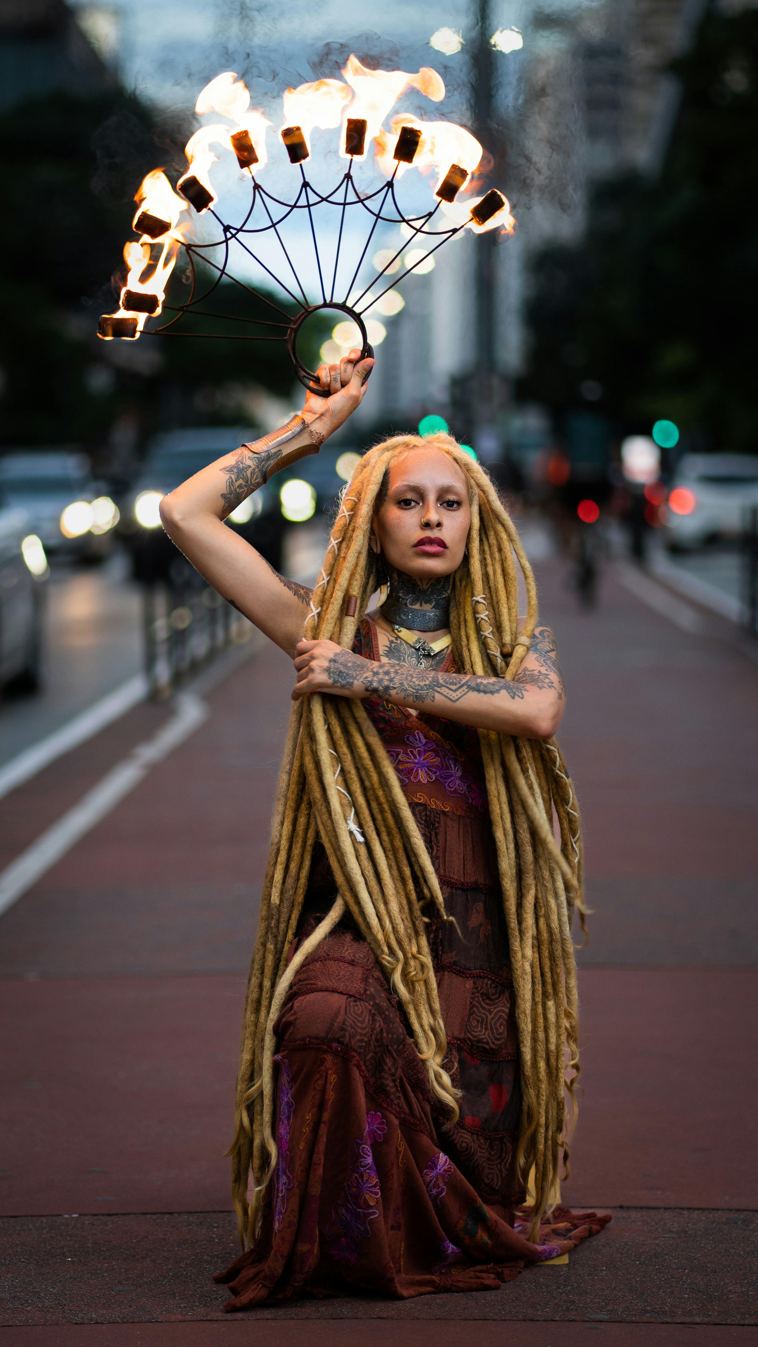 Woman with Blonde Dreadlocks in Fire Performance · Free Stock Photo