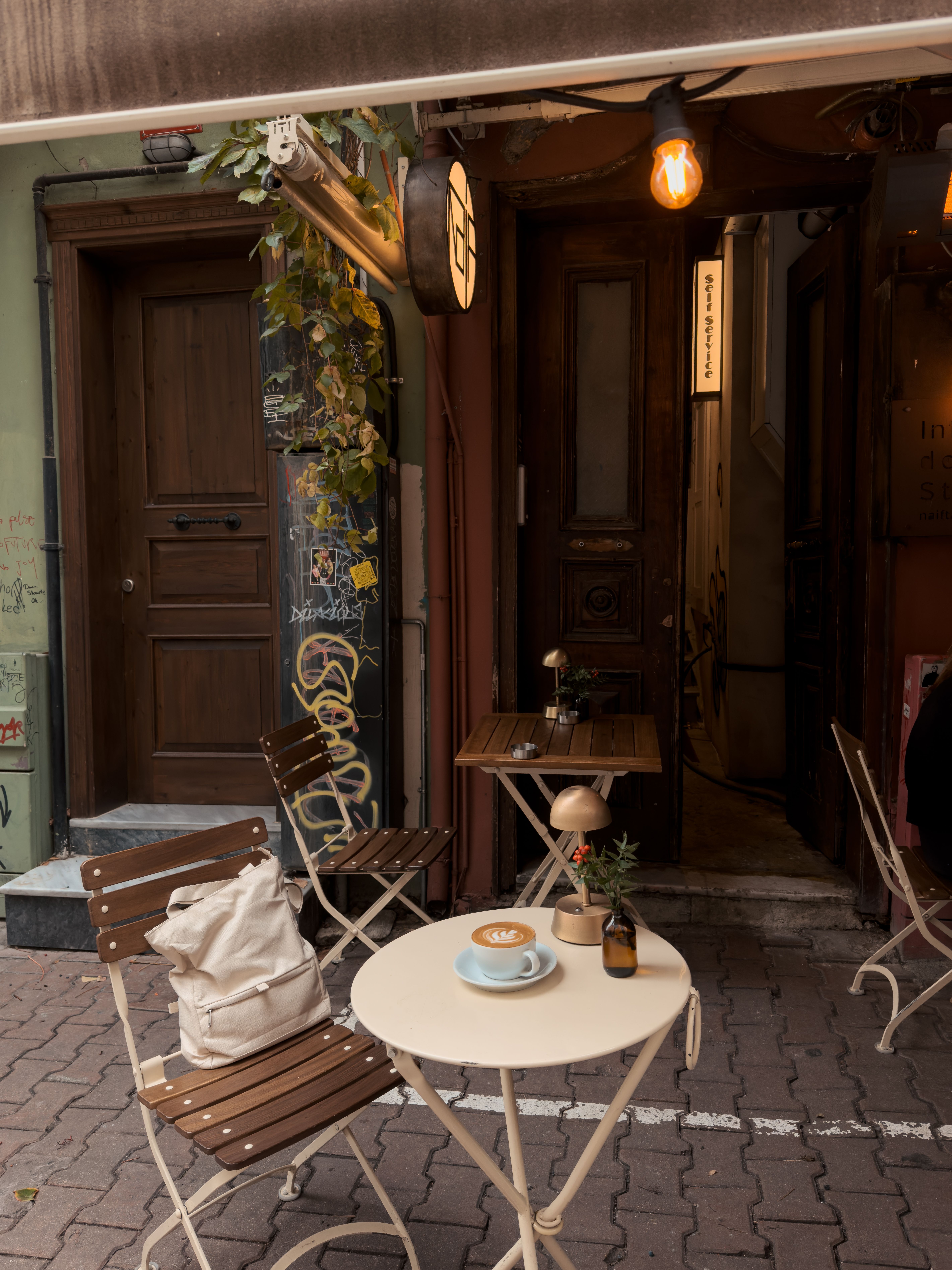 Brown and Orange 3-piece Patio Set Outside A Coffee Shop · Free Stock Photo
