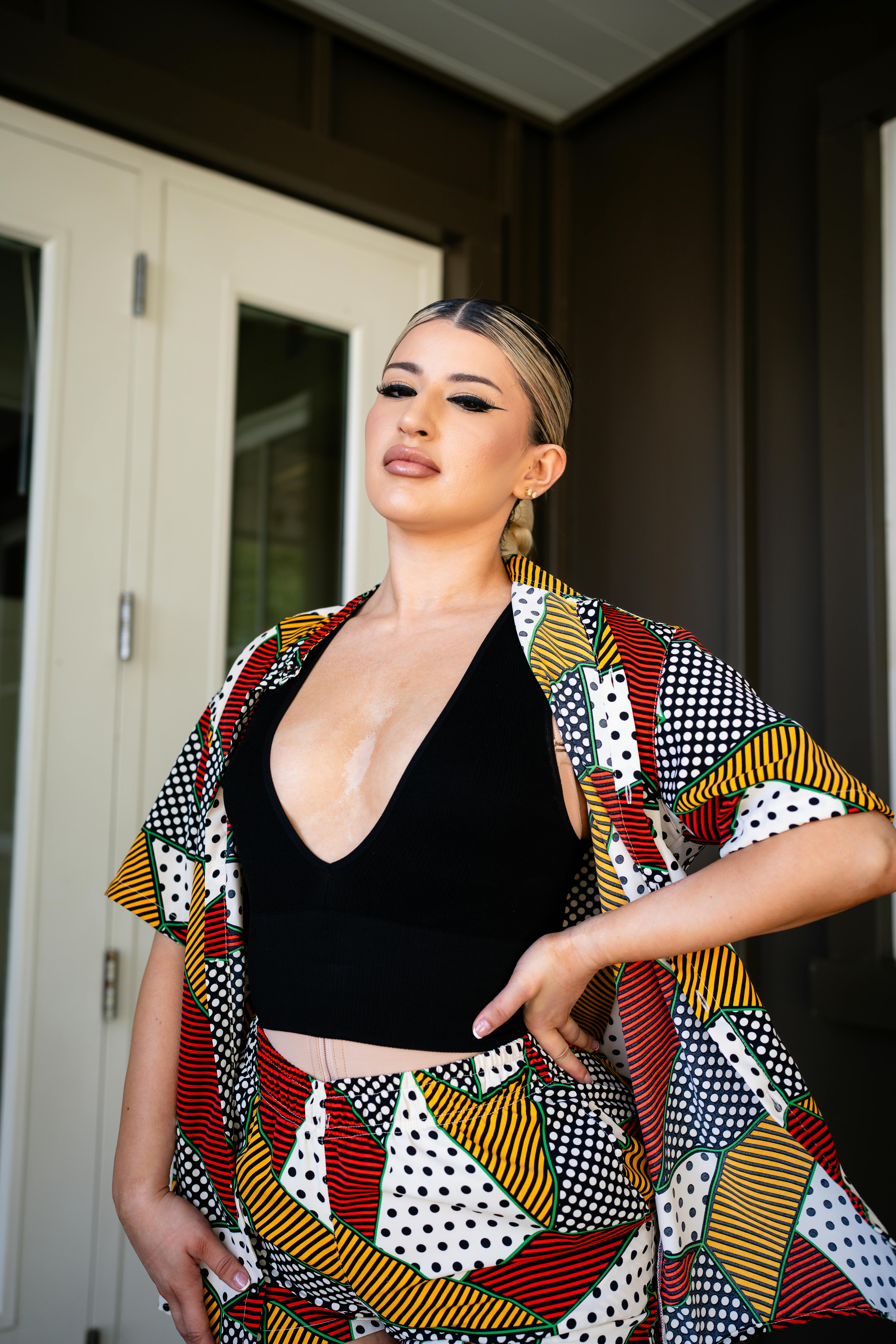 Blonde Posing in a Patterned Overalls · Free Stock Photo