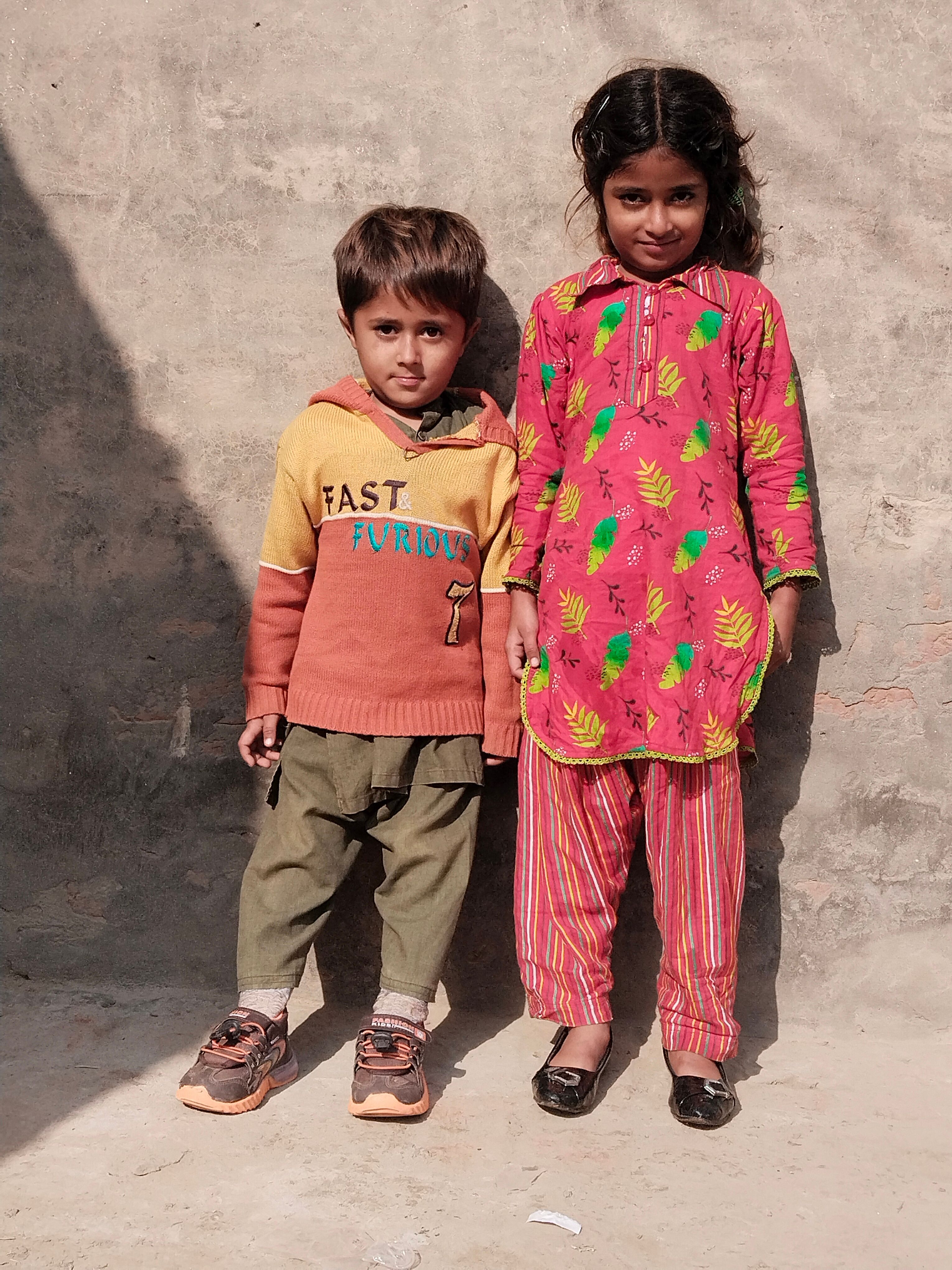Kids Standing by Gray Wall · Free Stock Photo