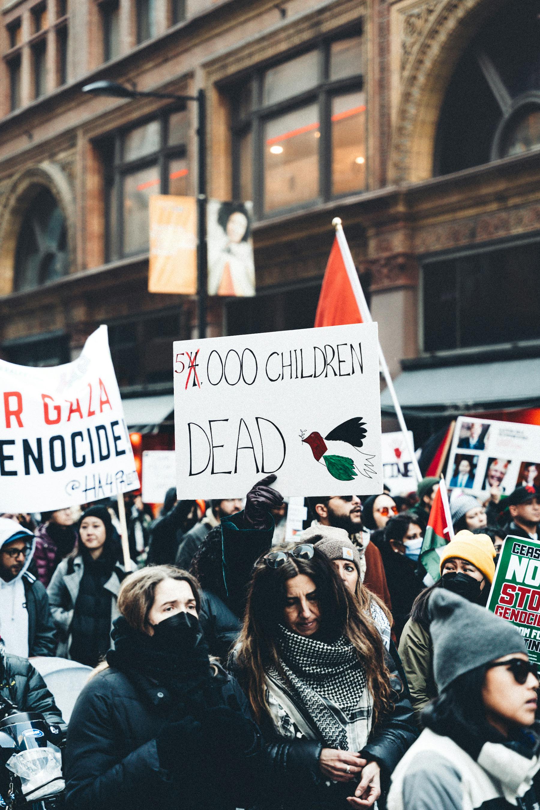 Crowd of Protesters with Banners Walking on the Street · Free Stock Photo