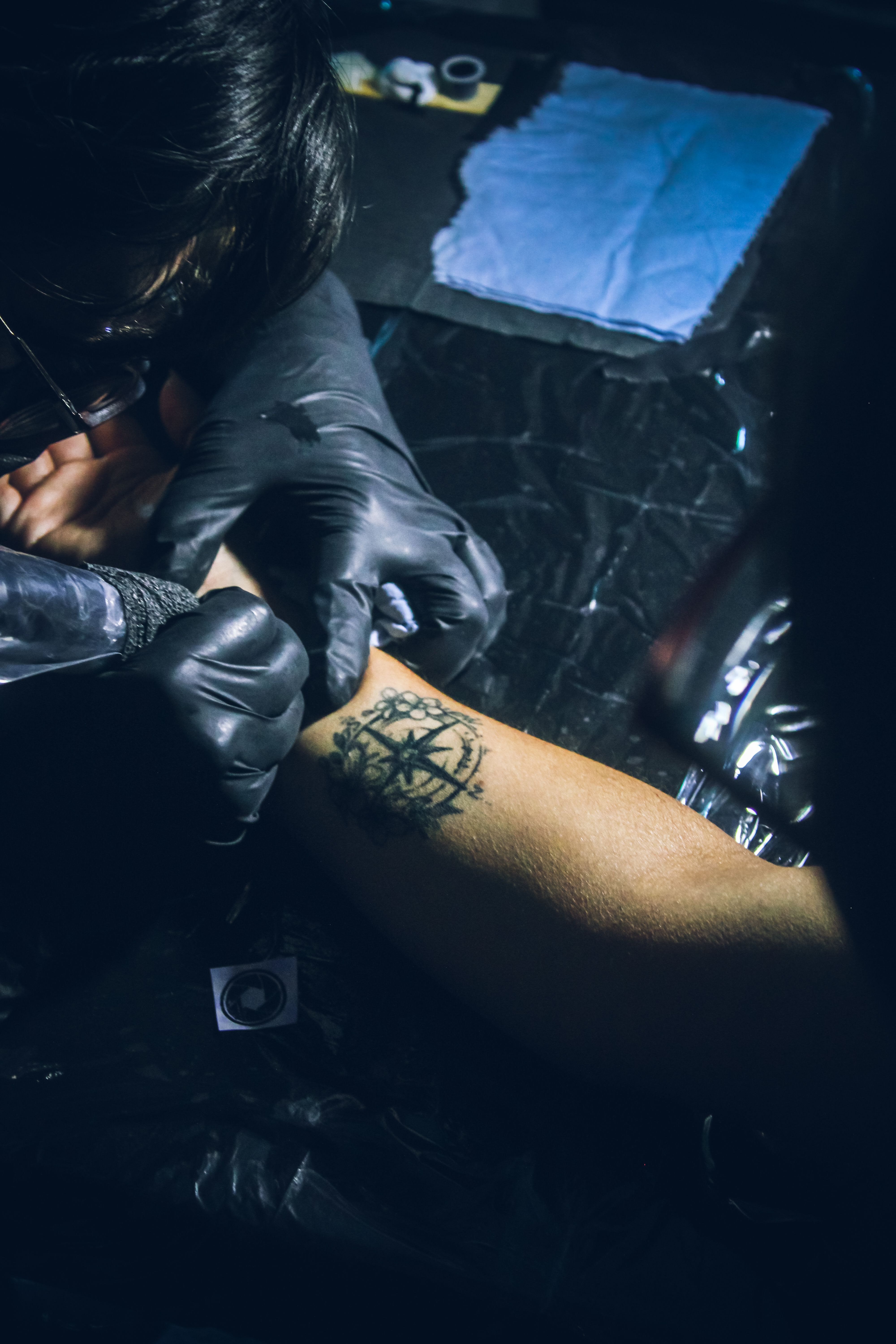 Tattooist Making Tattoo on Forearm · Free Stock Photo