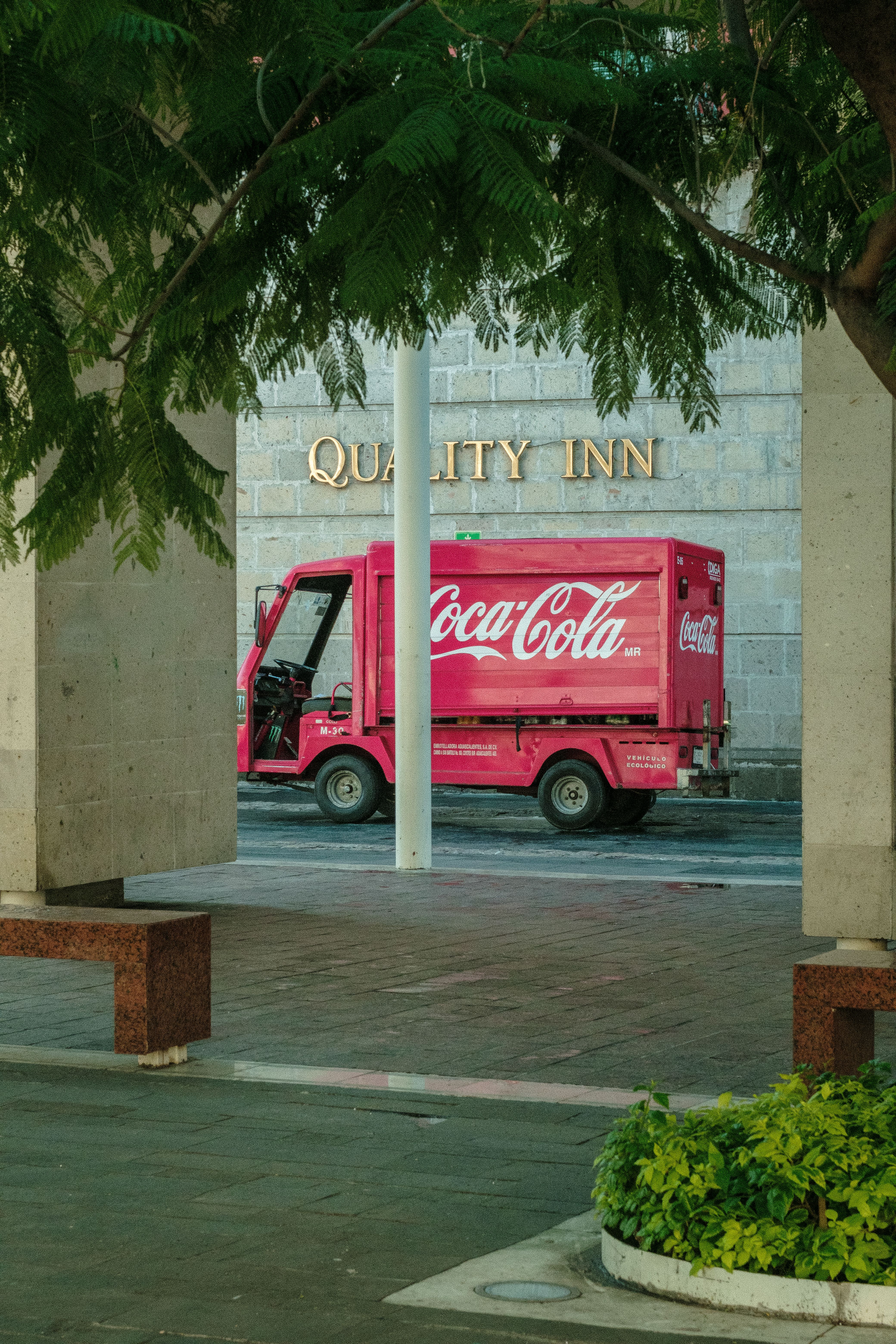 Coca Colar Delivery Van in Front of a Hotel · Free Stock Photo