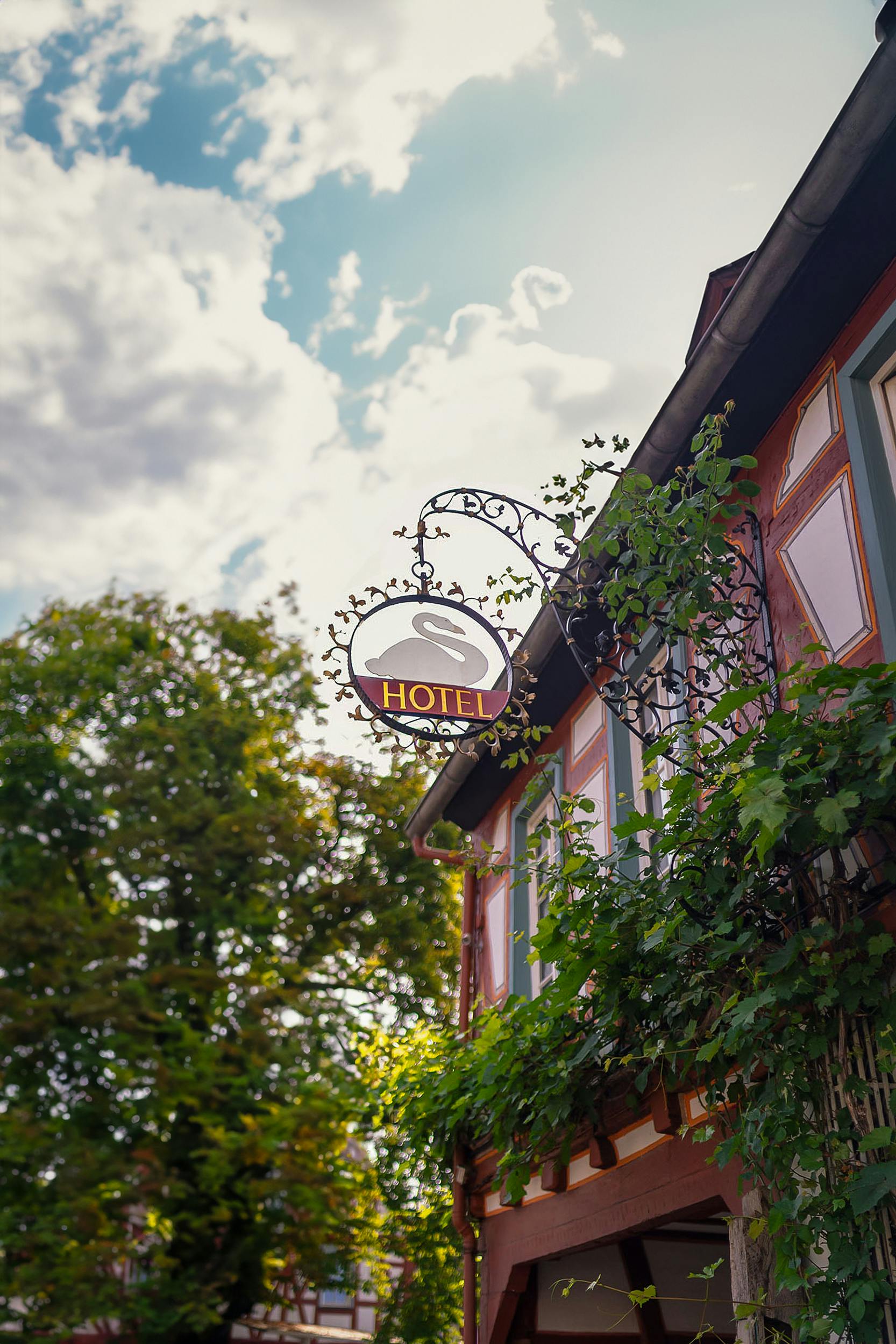 Metal Hotel Sign with a Swan · Free Stock Photo