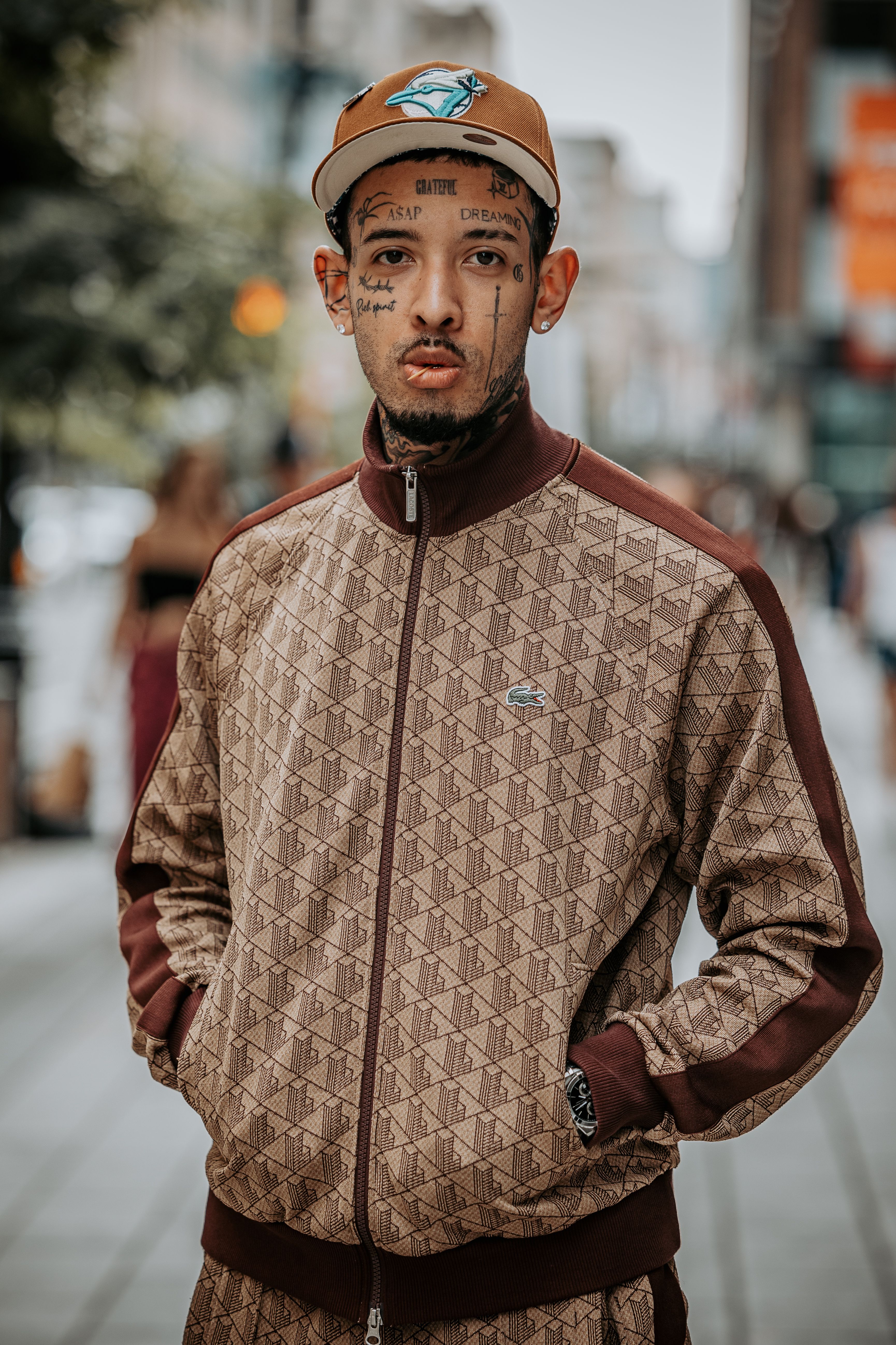 Portrait of Man Wearing Tracksuit on a Street · Free Stock Photo